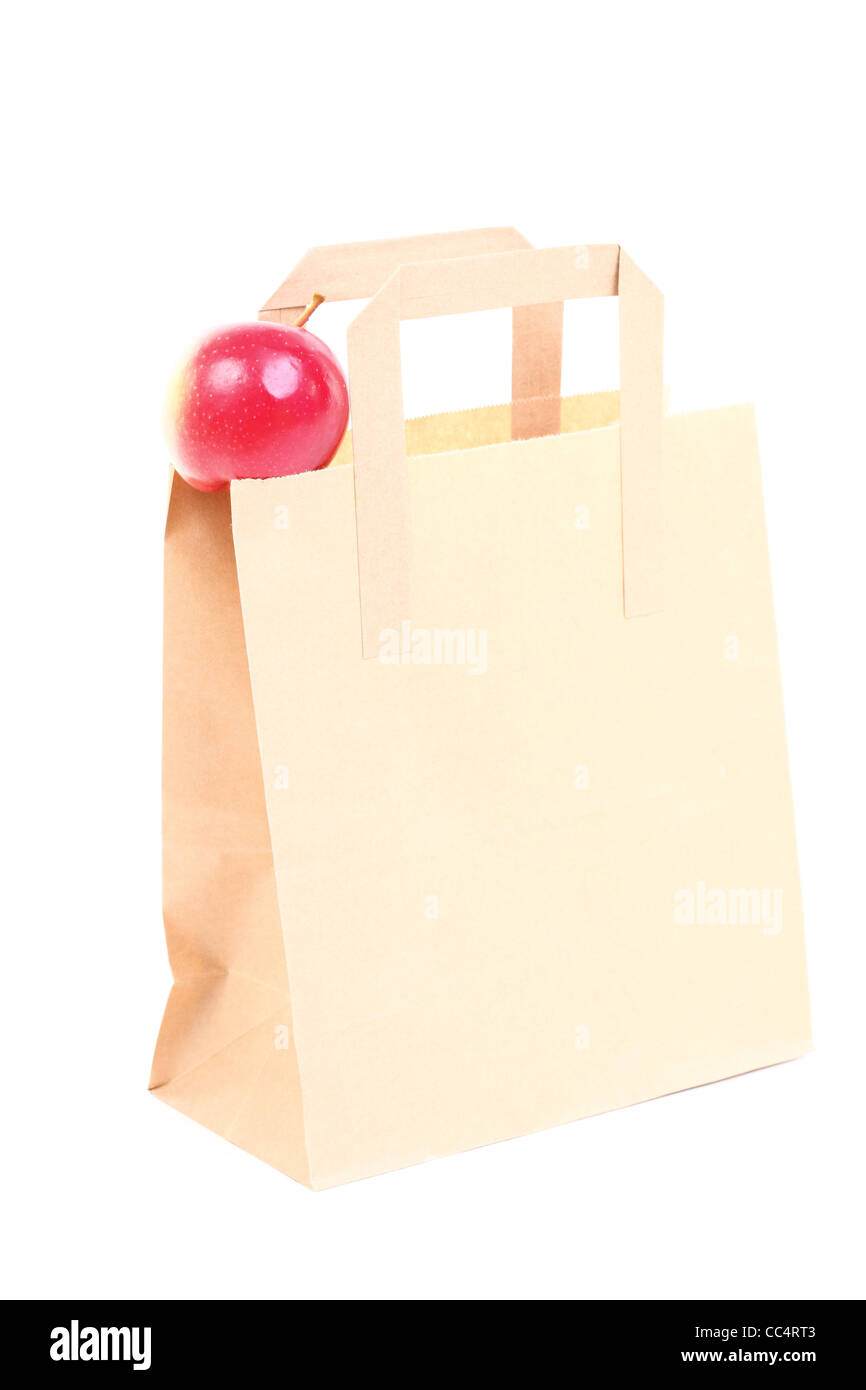 Shopping brown recycle gift bags and red apple isolated on white ...
