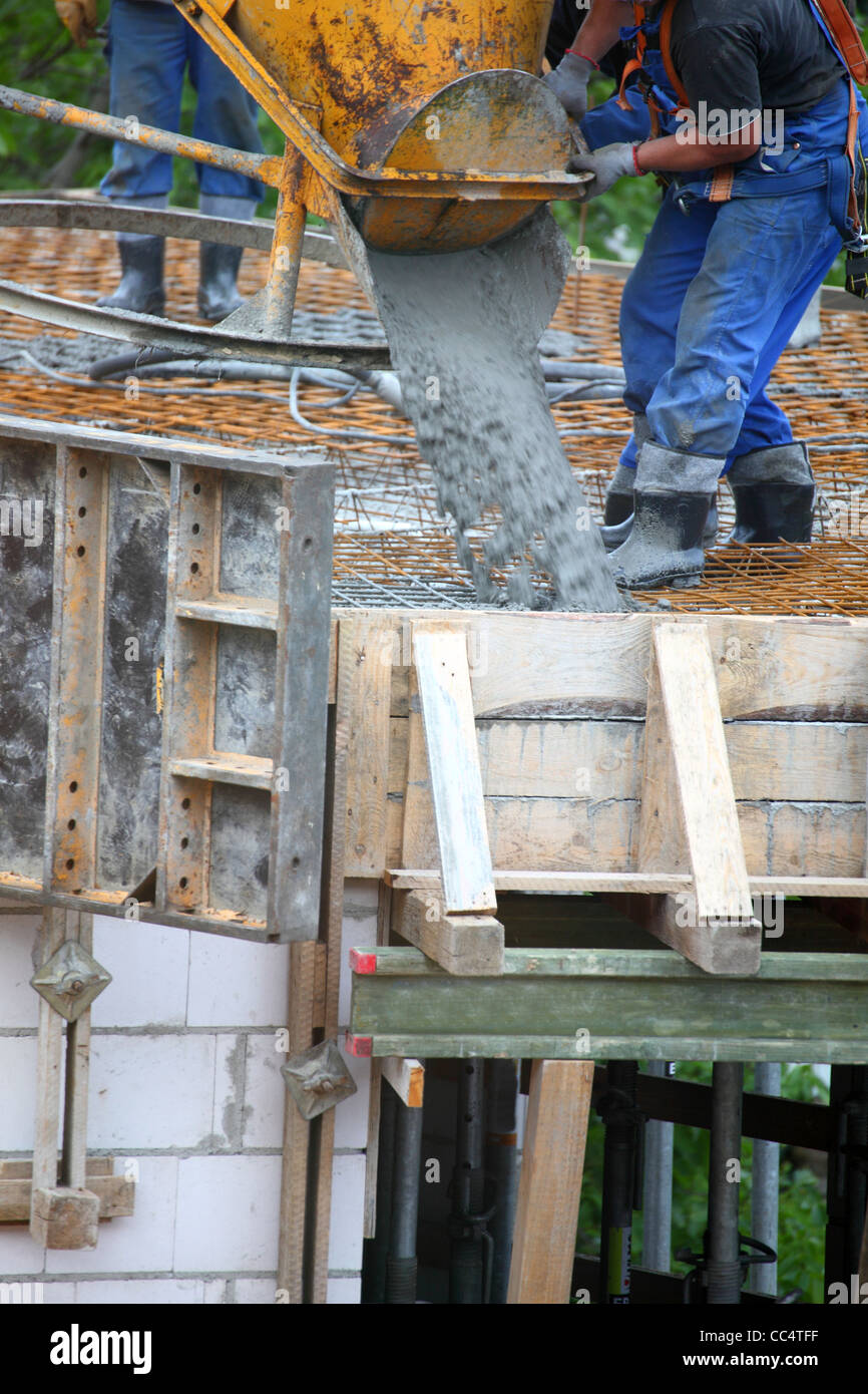 Work place. Worker with concrete Stock Photo - Alamy