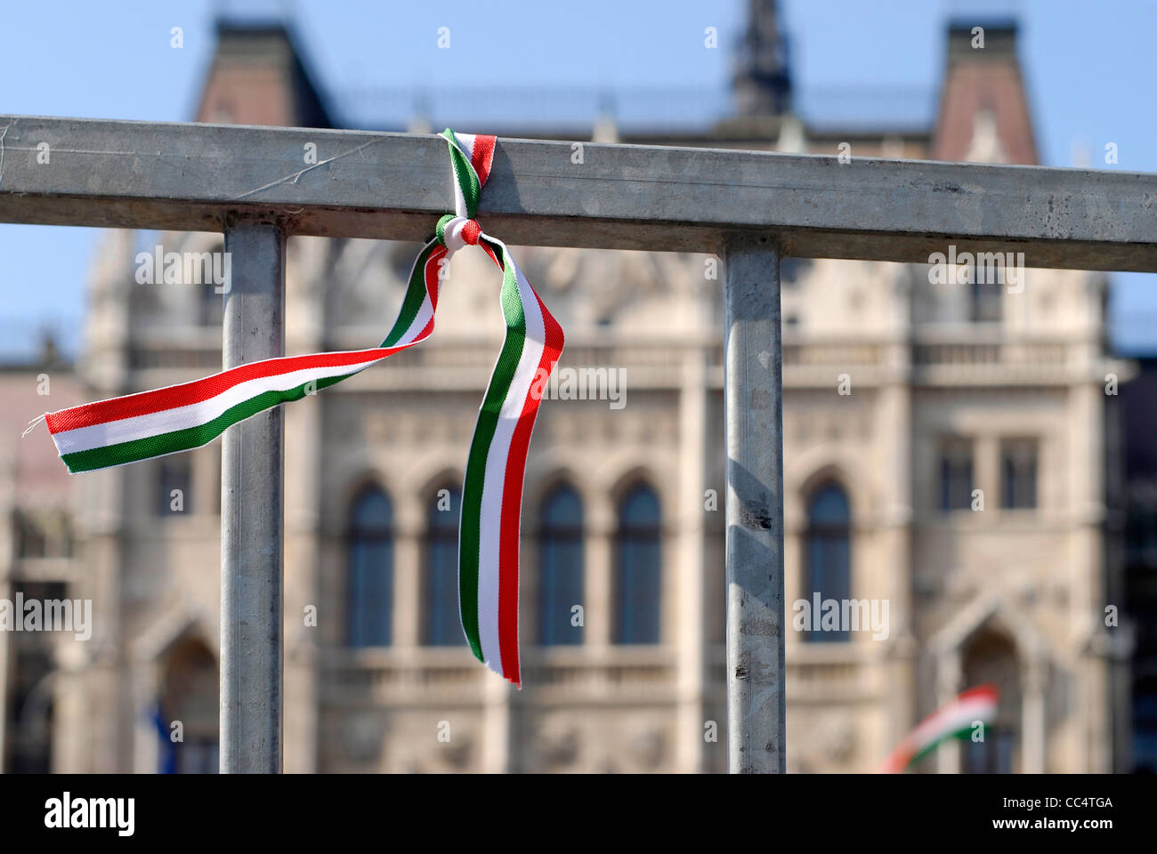 A Hungarian tricolor ribbon in the fence in front of the Parliament in ...
