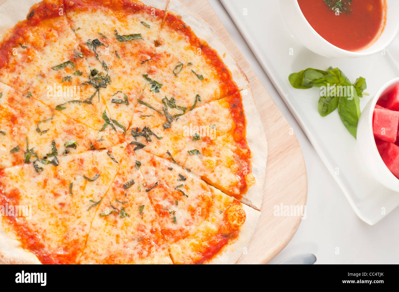 Italian original thin crust pizza Margherita with gazpacho soup and ...