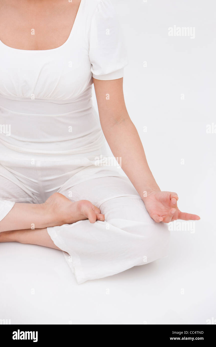 Hand of young woman sitting and meditating Stock Photo - Alamy