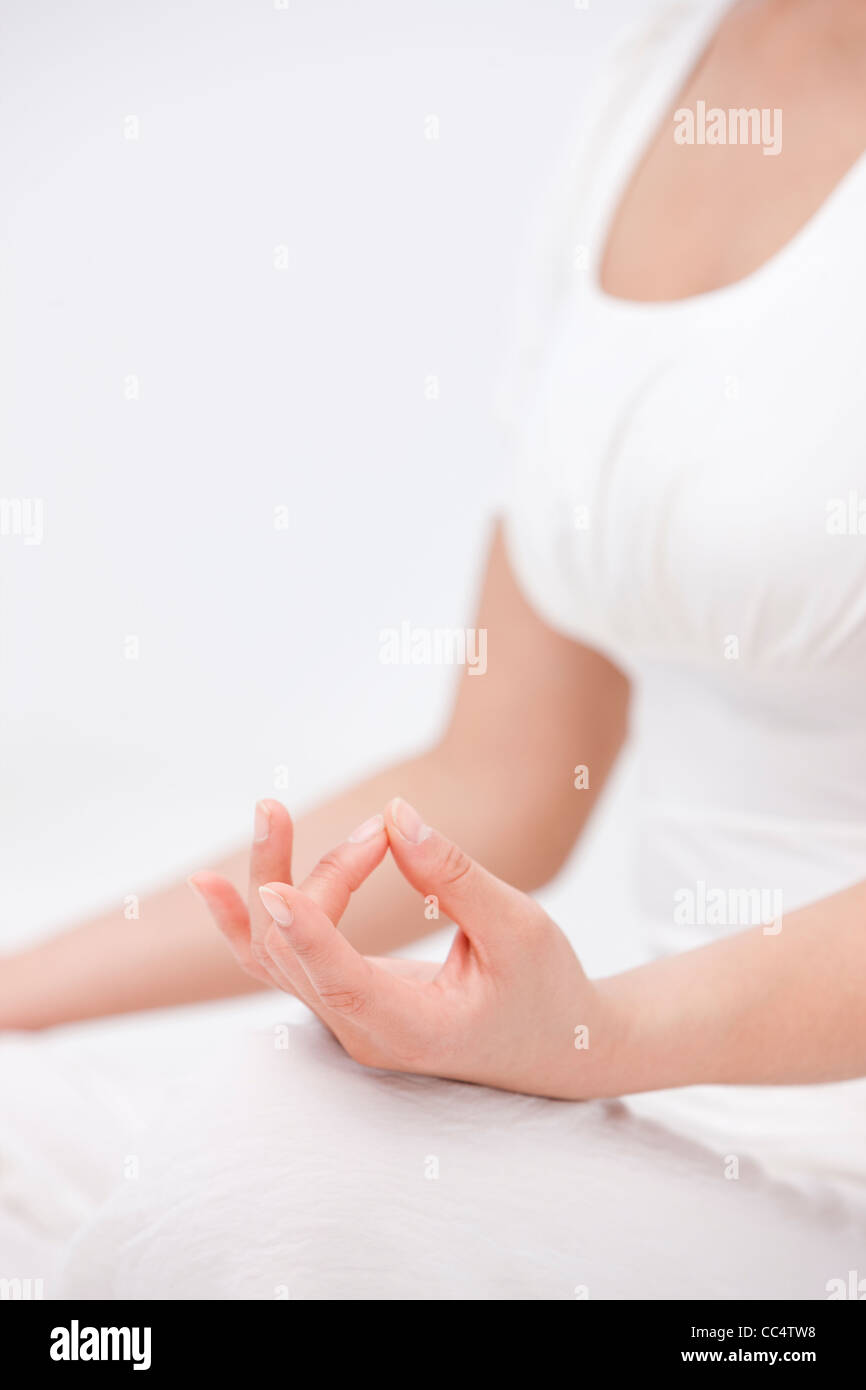 Hand of young woman sitting and meditating Stock Photo - Alamy