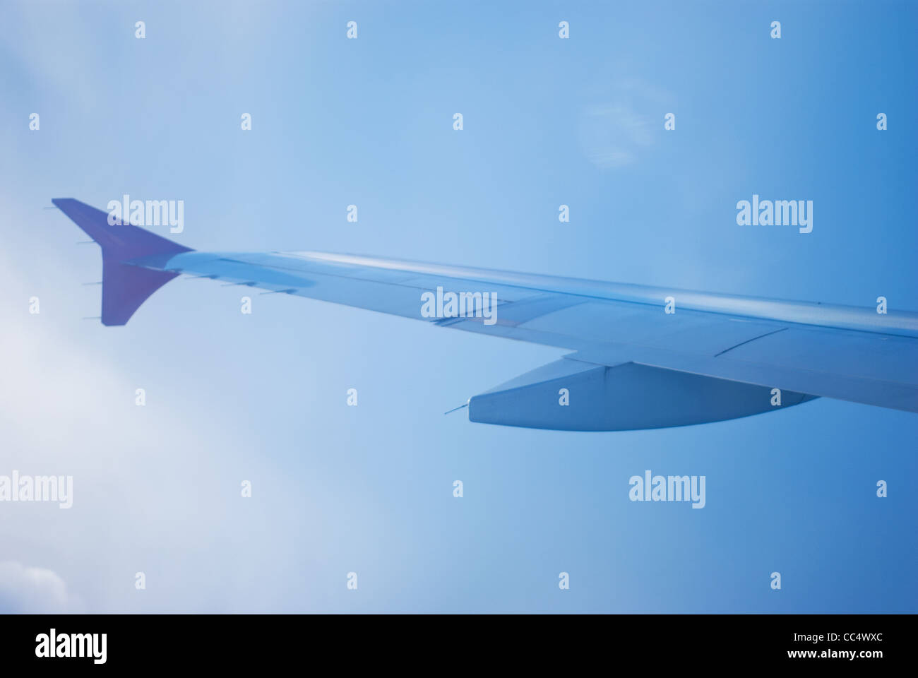 Wing aircraft in motion in the air above blue sky with clouds Stock ...