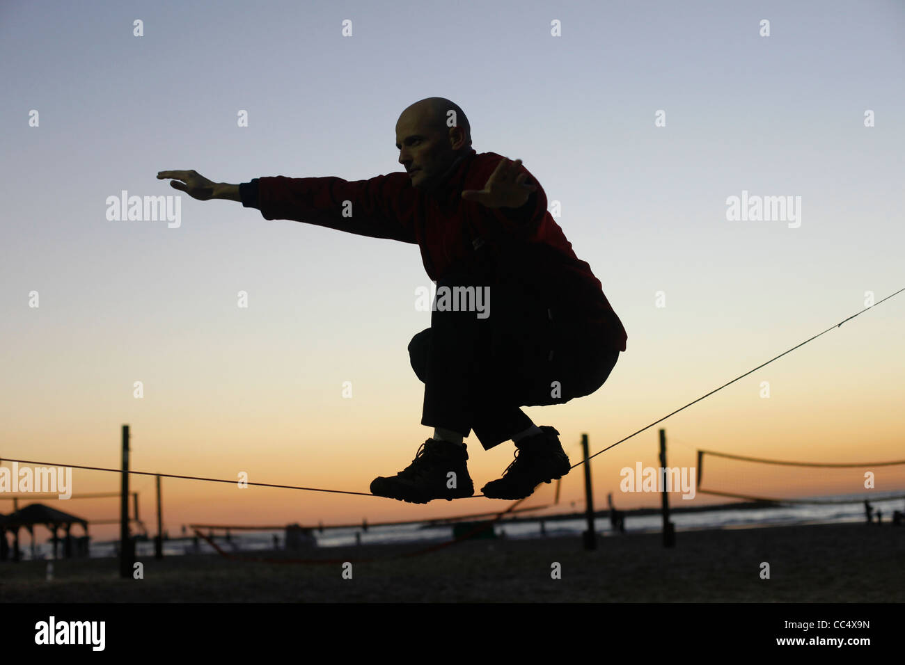 Man Walking Tightrope Stock Photos & Man Walking Tightrope Stock Images ...