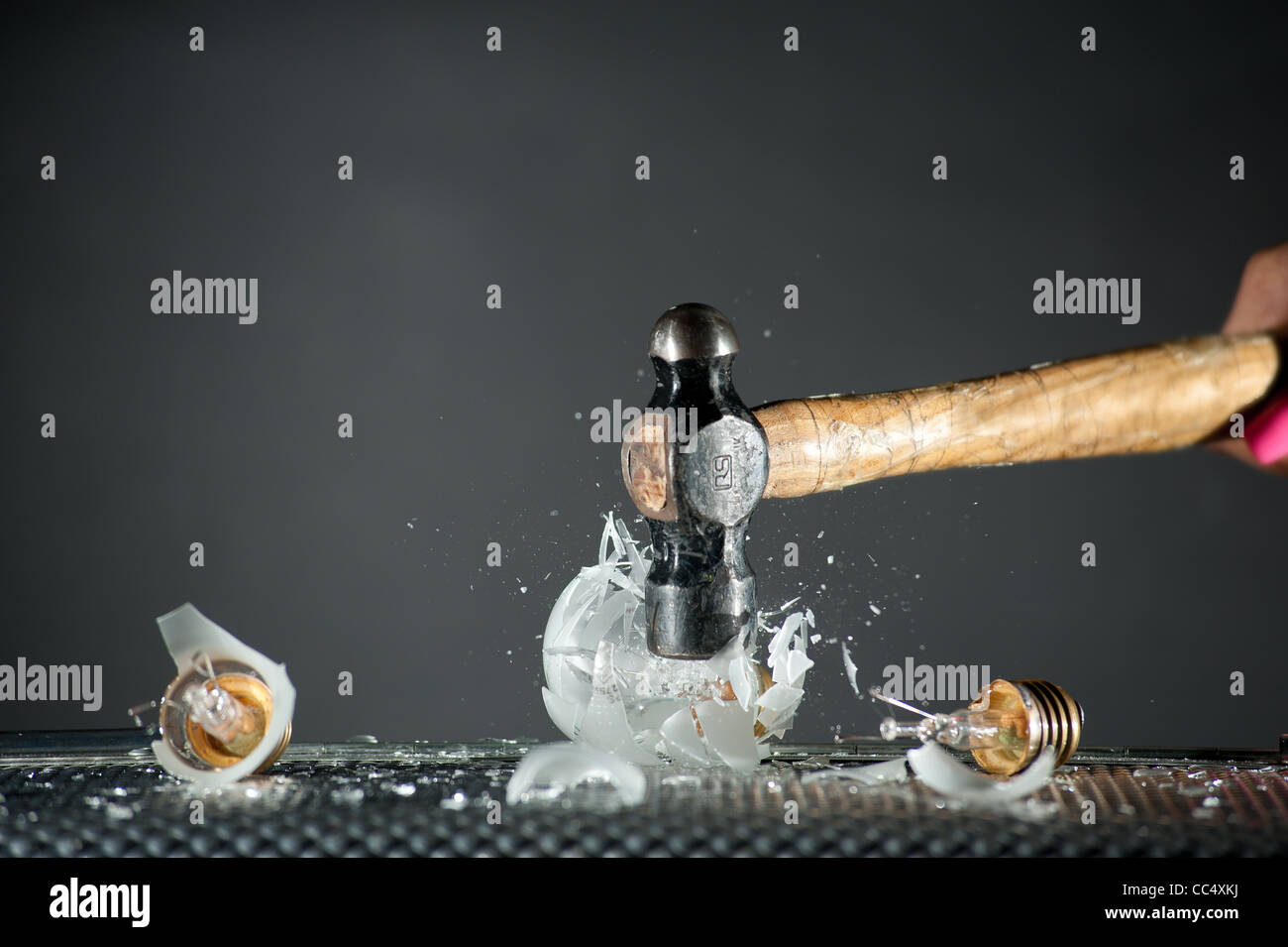 Broken light bulb hammer hi-res stock photography and images - Alamy