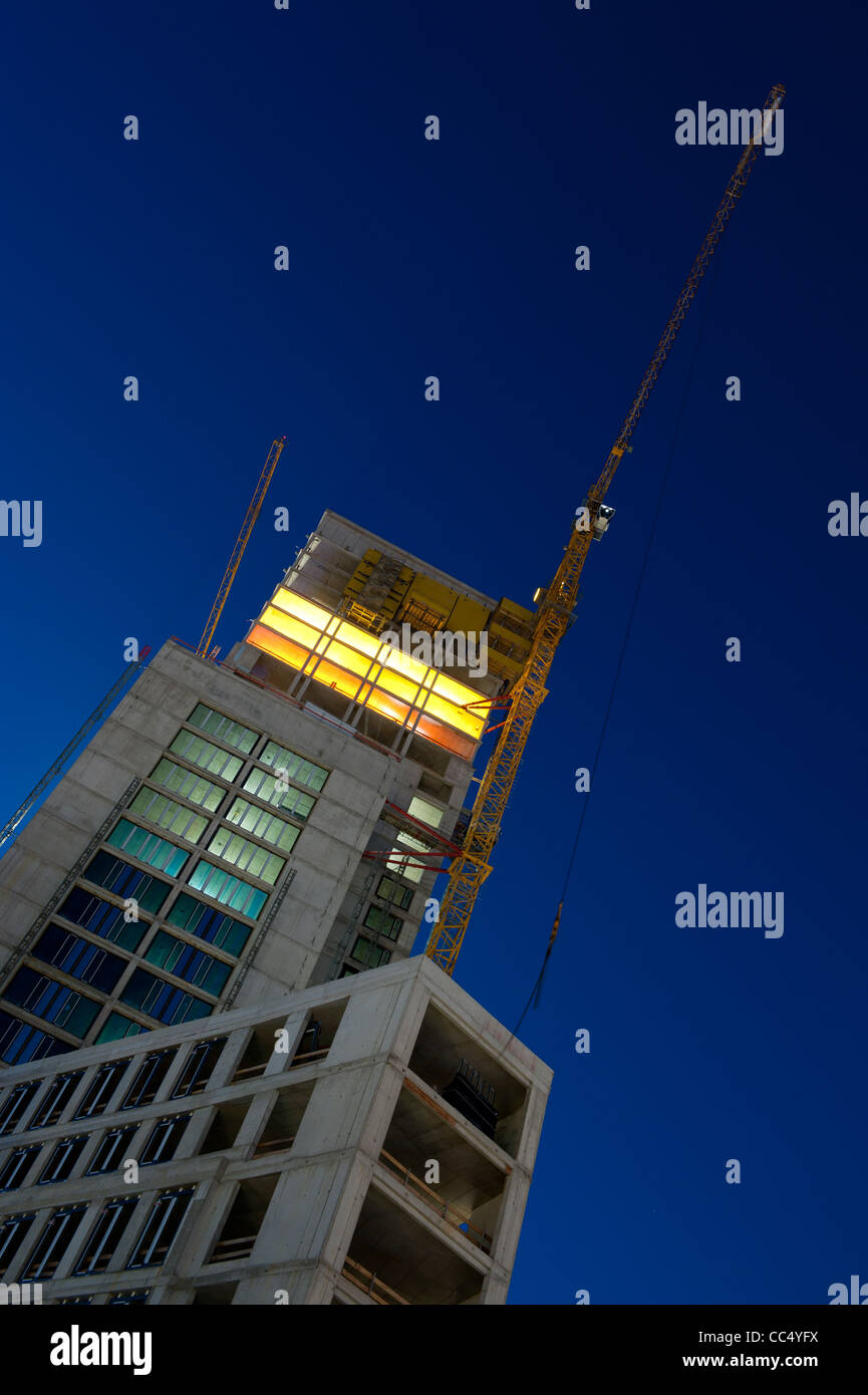 night shot of construction building site with tower crane loader Stock ...