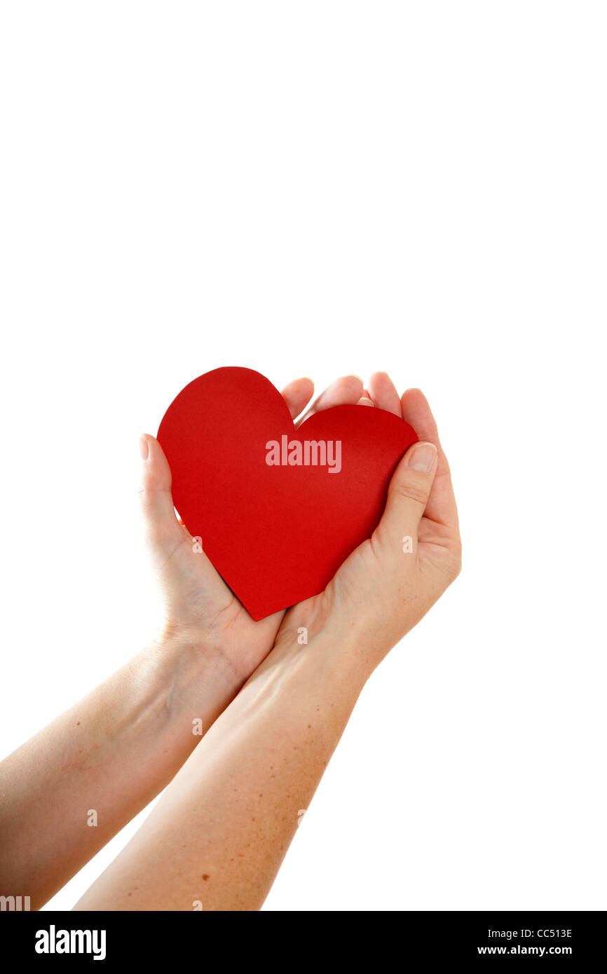Hands cupping heart Stock Photo - Alamy