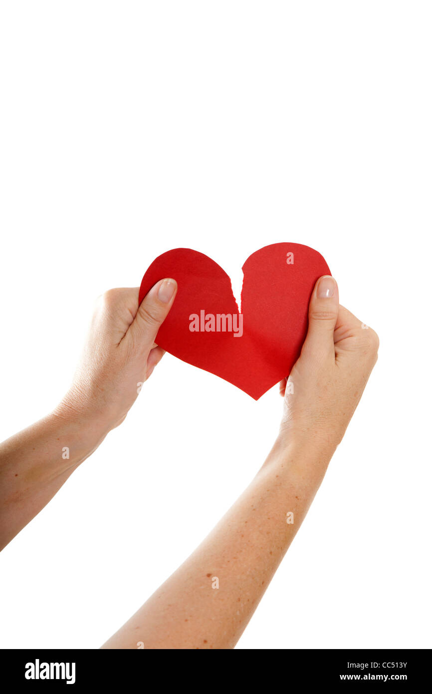 Hands Ripping paper heart Stock Photo - Alamy