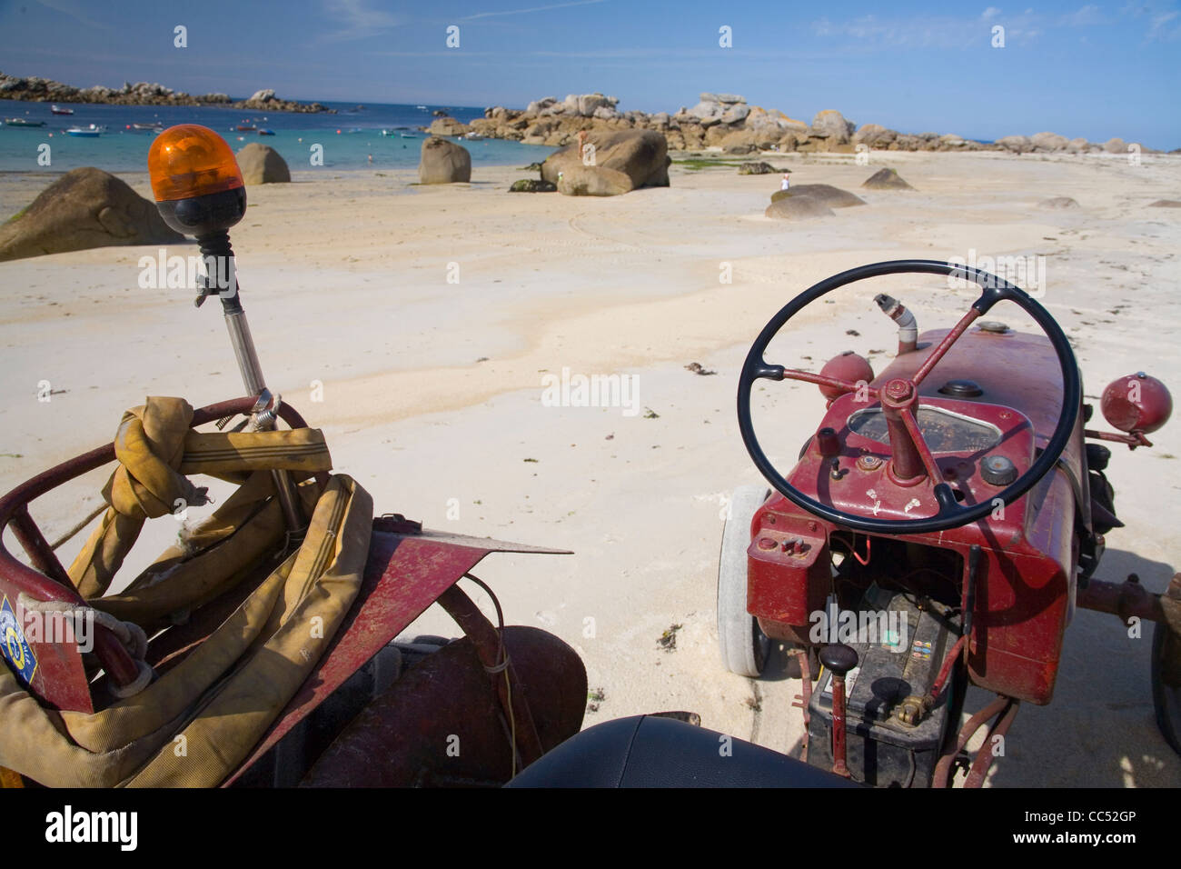 Tractor used to launch boats on the beach, Brittany, Atlantic coast ...