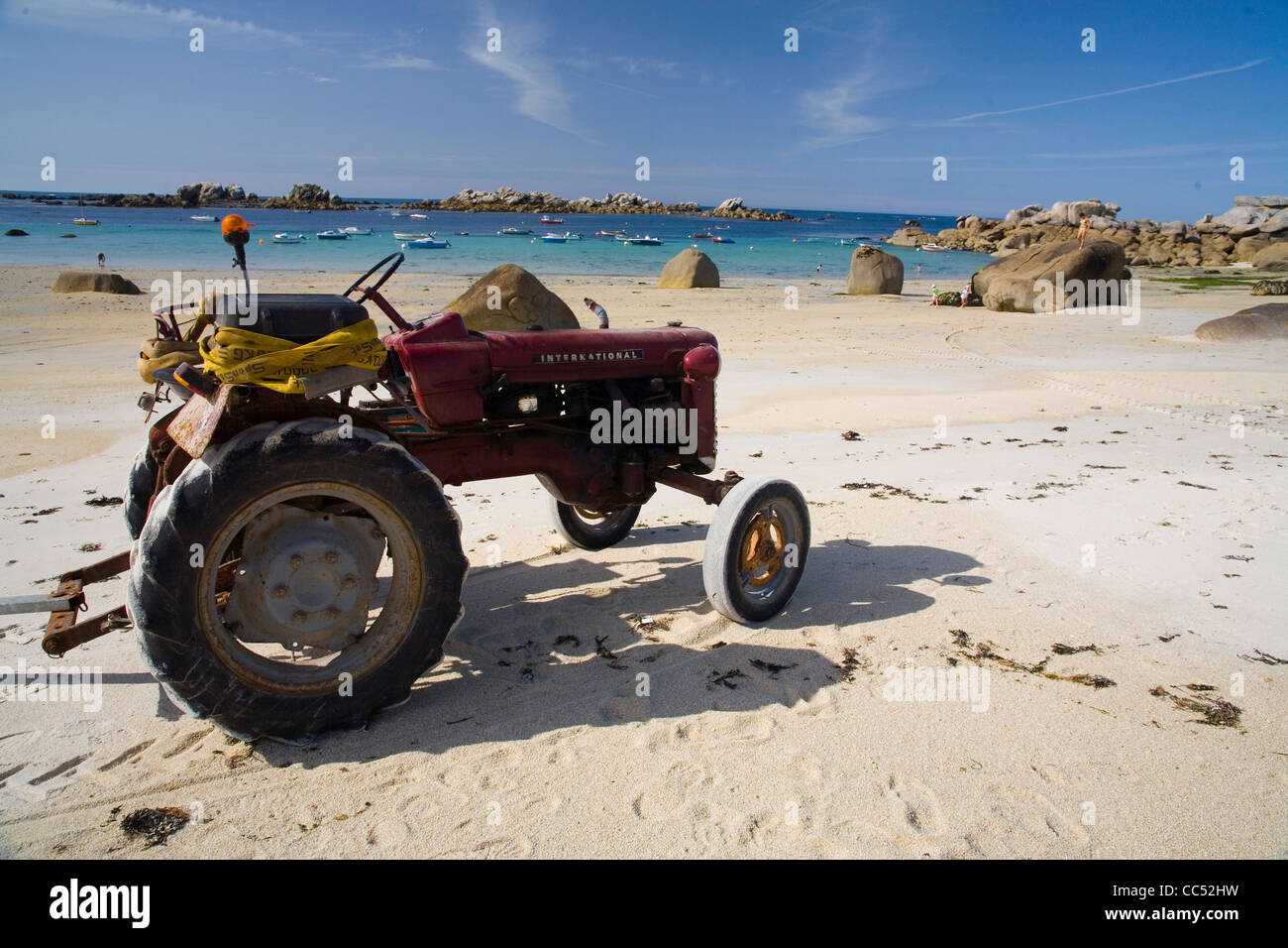 Tractor used to launch boats on the beach, Brittany, Atlantic coast ...