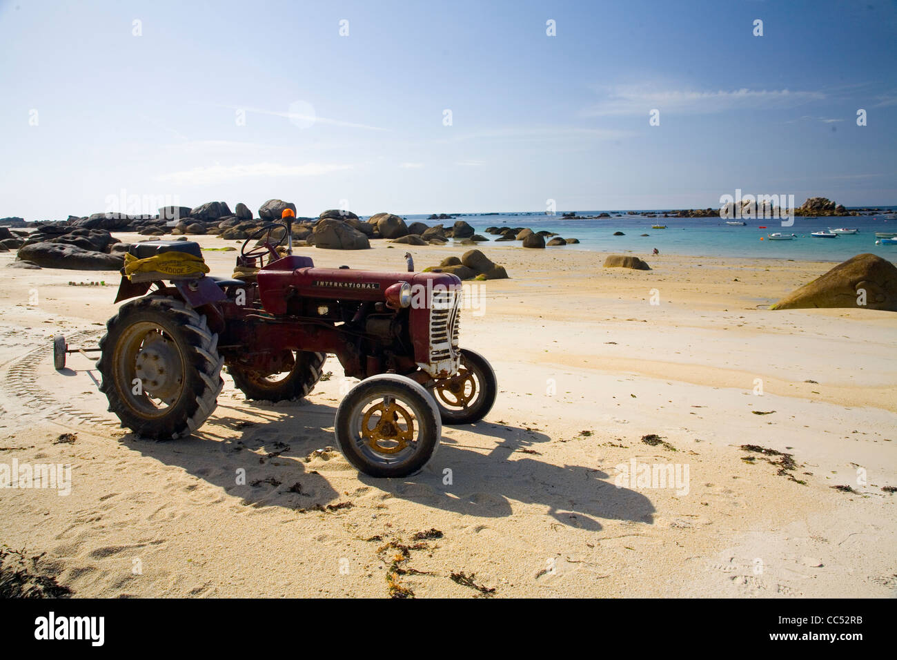 Tractor used to launch boats on the beach, Brittany, Atlantic coast ...