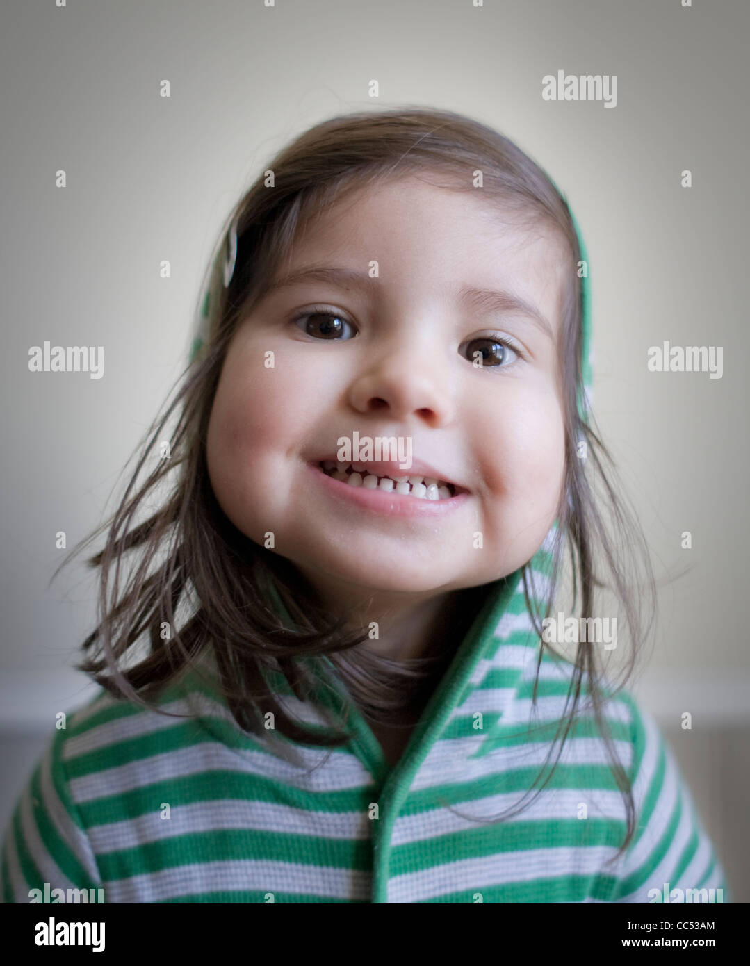 Girl wearing green striped top Stock Photo - Alamy