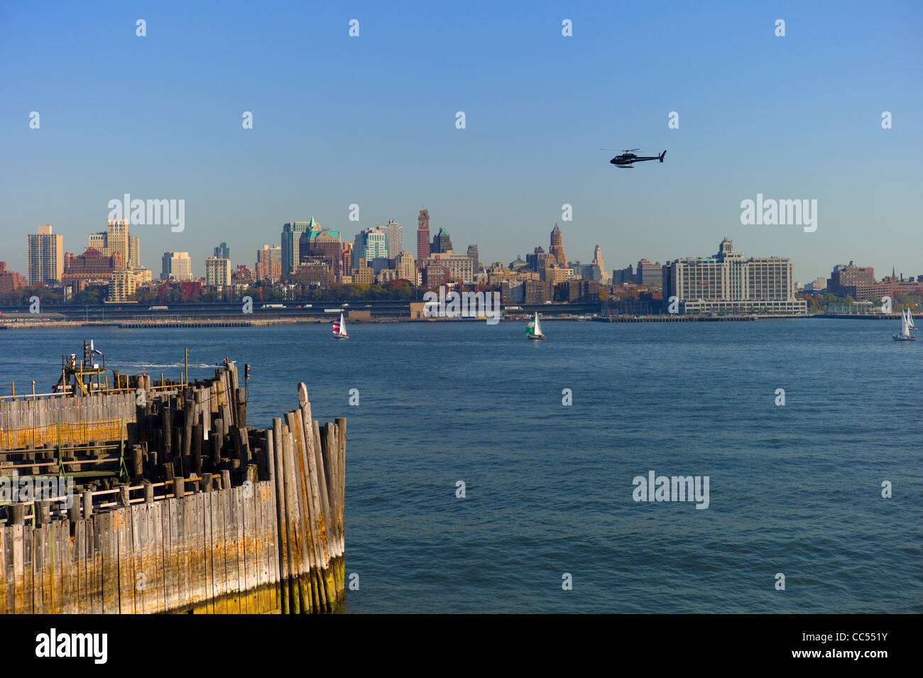 Helicopter flying over the Hudson River with sailing boats Lower ...