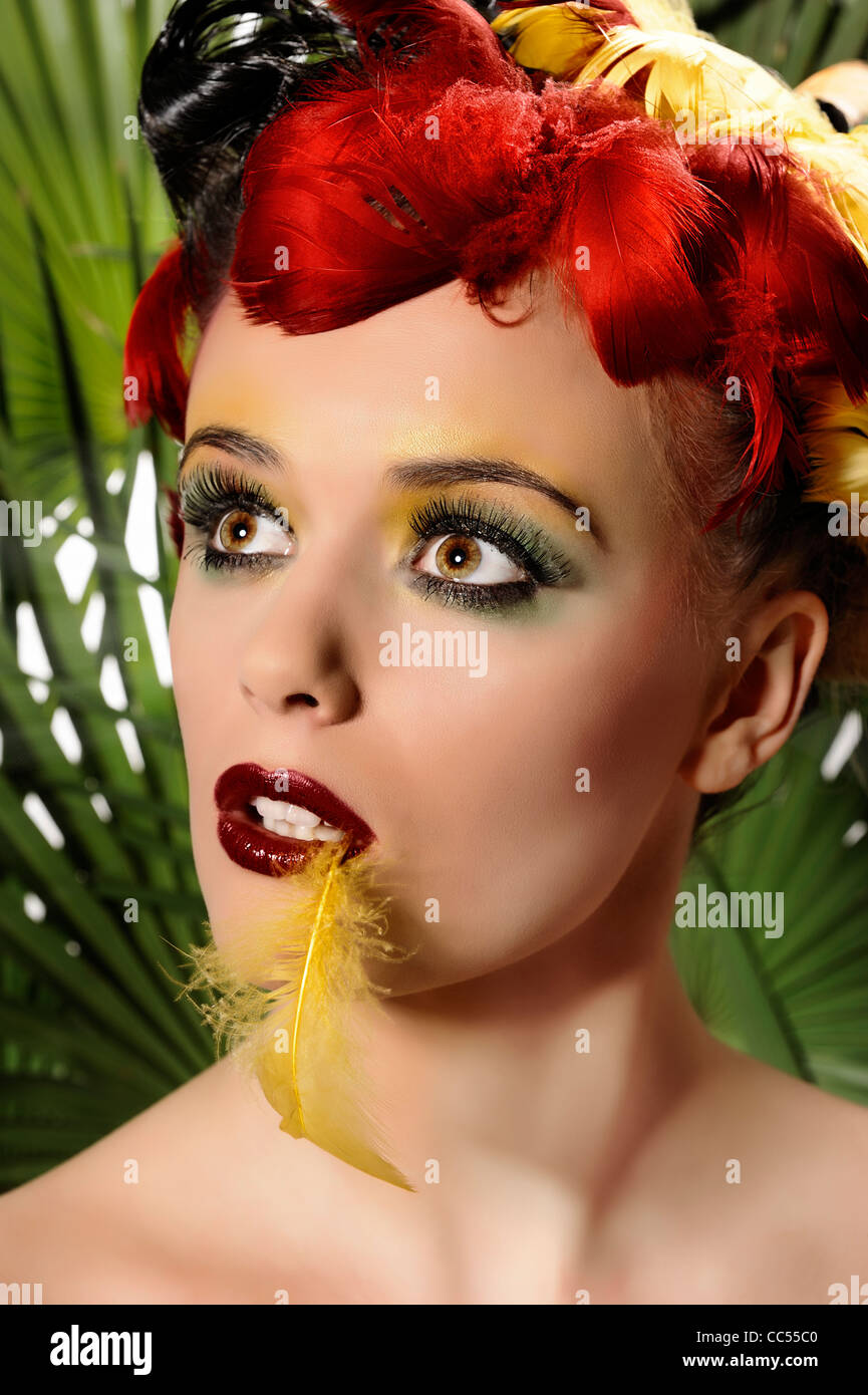 portrait of a beautiful young woman like parrots Stock Photo - Alamy