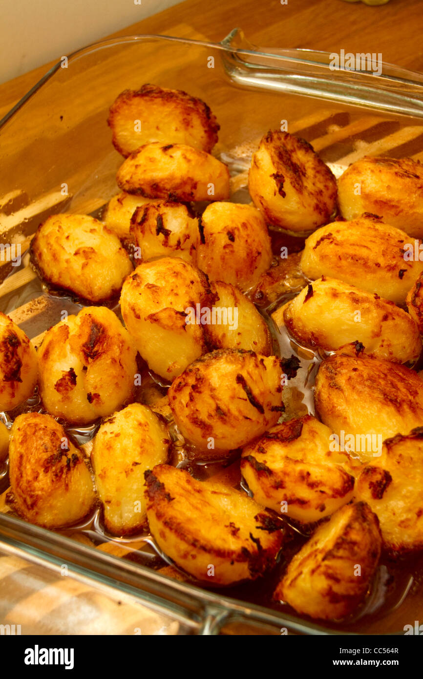 Freshly cooked roast potatoes just out of the oven Stock Photo - Alamy