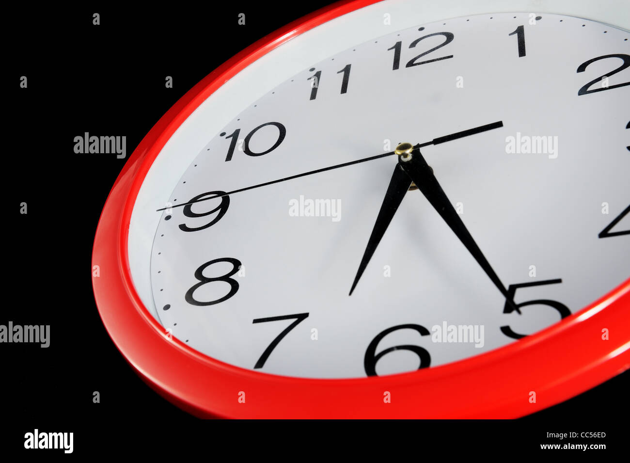 Clock detail view isolated on black background Stock Photo - Alamy