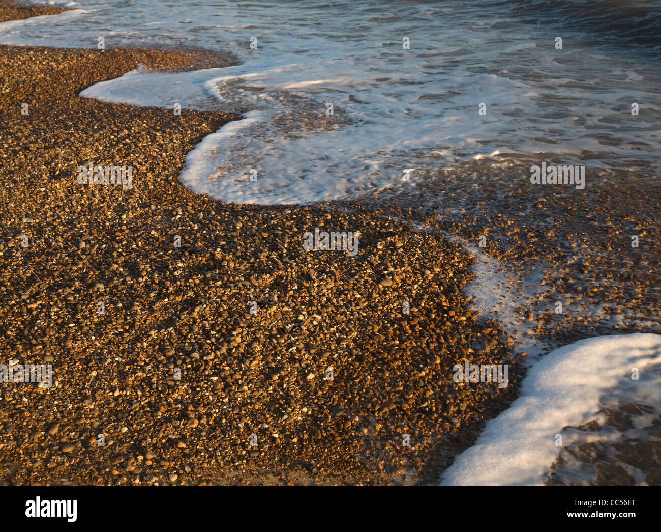 Wave swash forming shingle beach cusps Stock Photo - Alamy