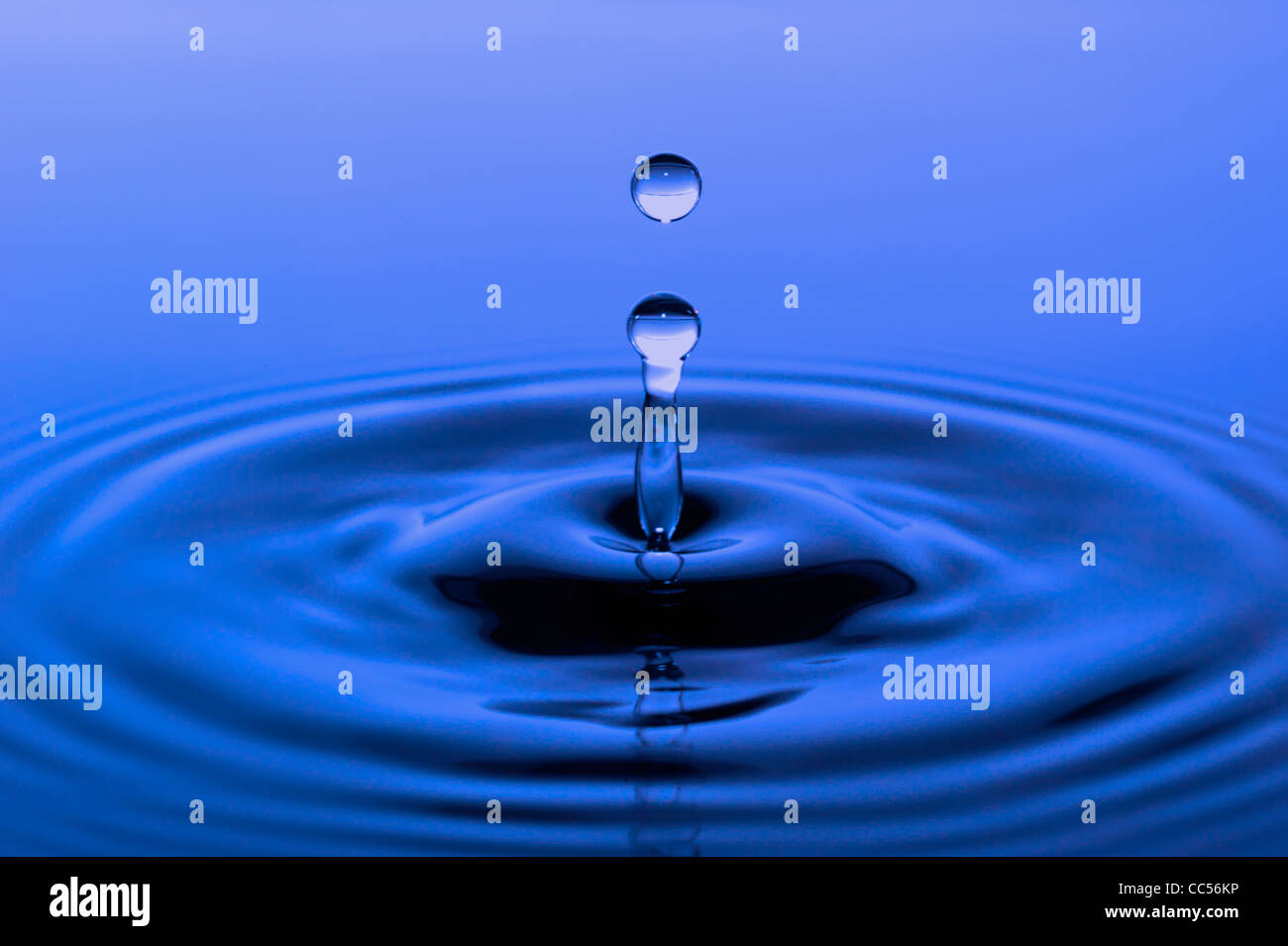 single water drop on blue Stock Photo - Alamy