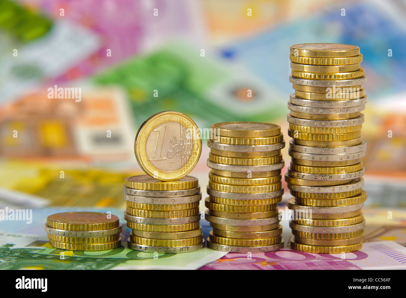 stacked euro coins on banknotes Stock Photo - Alamy