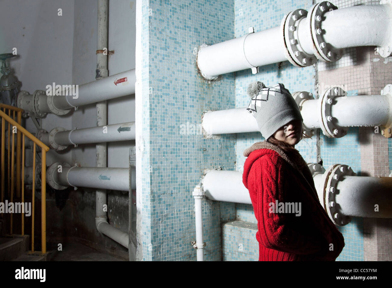 Asian woman in a factory showing its stress and sadness Stock Photo - Alamy