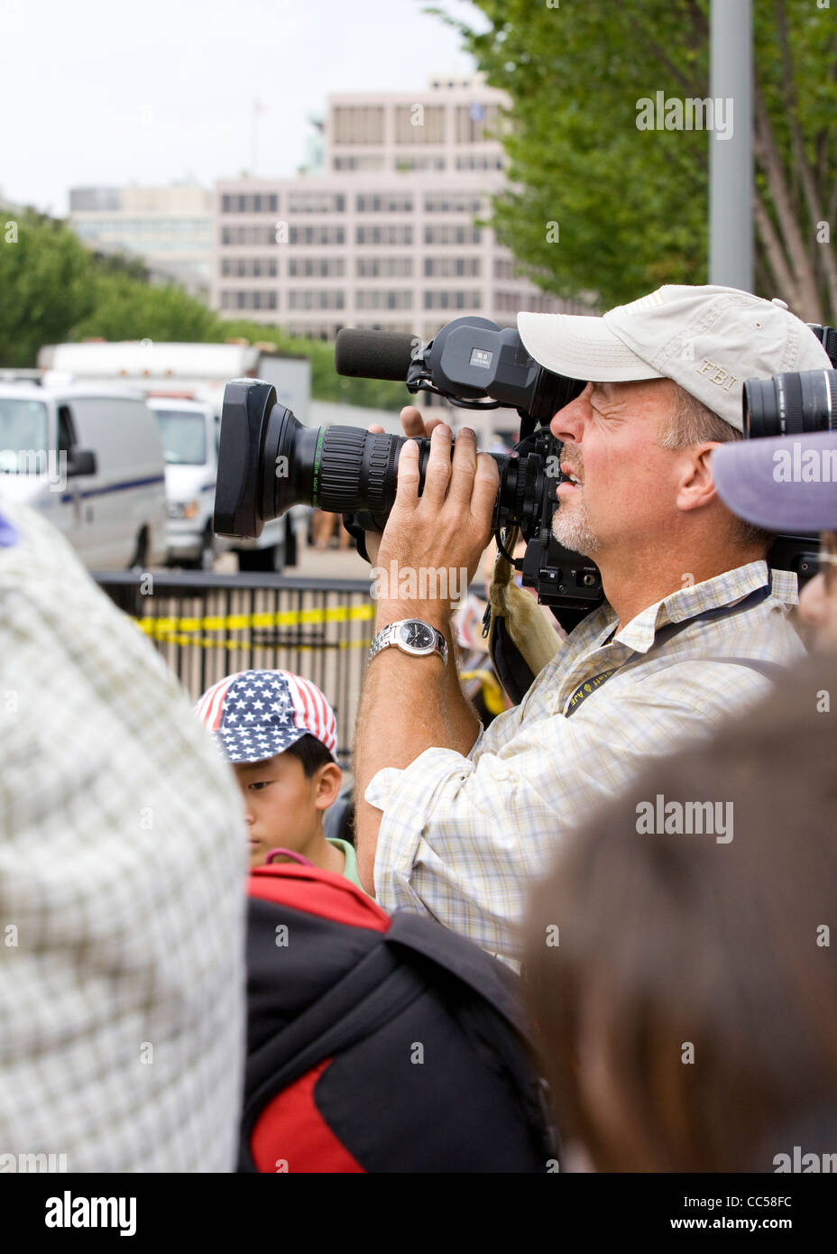 A news camera operator catches the action Stock Photo - Alamy