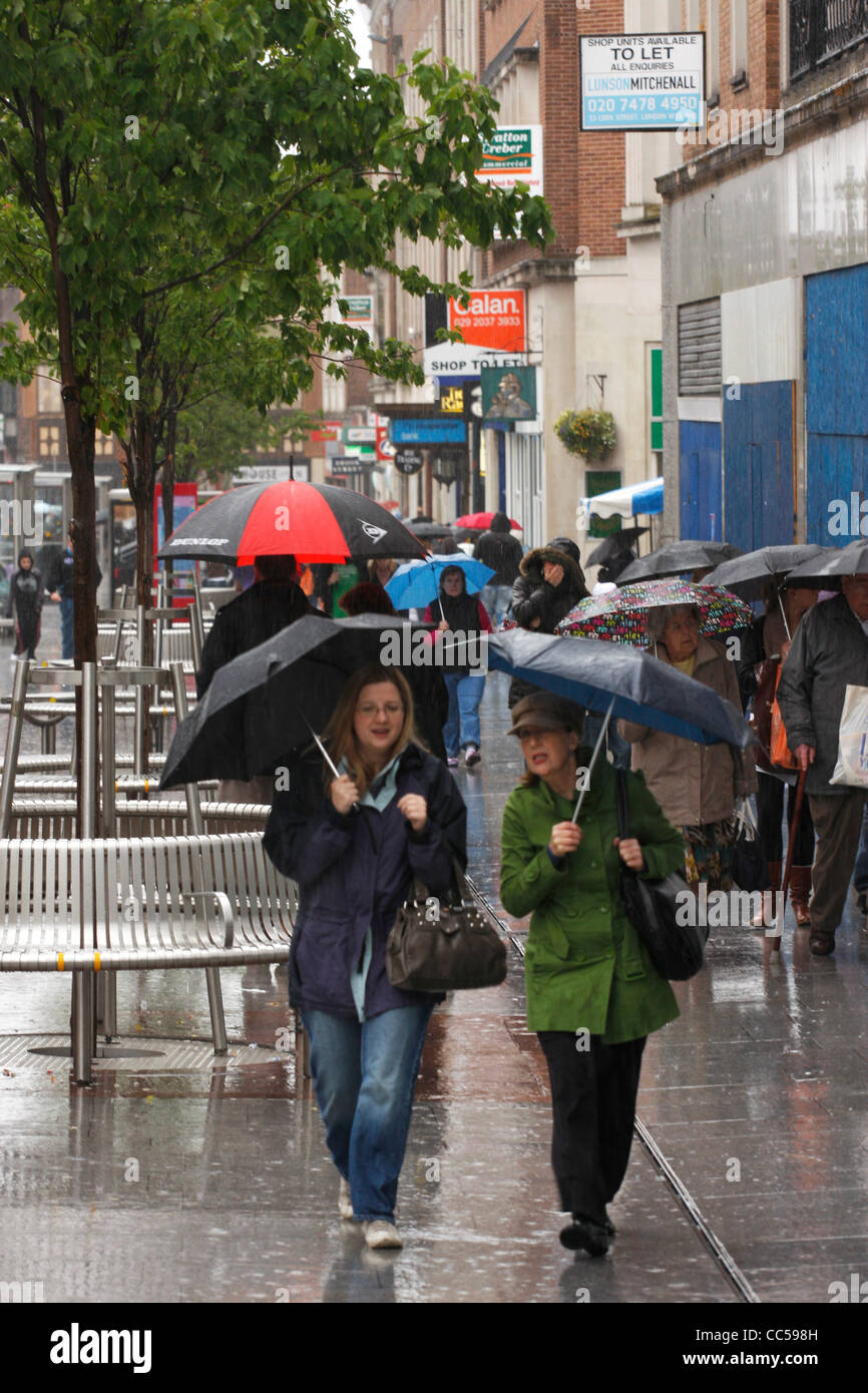 People getting wet in Exeter, Devon, UK Stock Photo - Alamy
