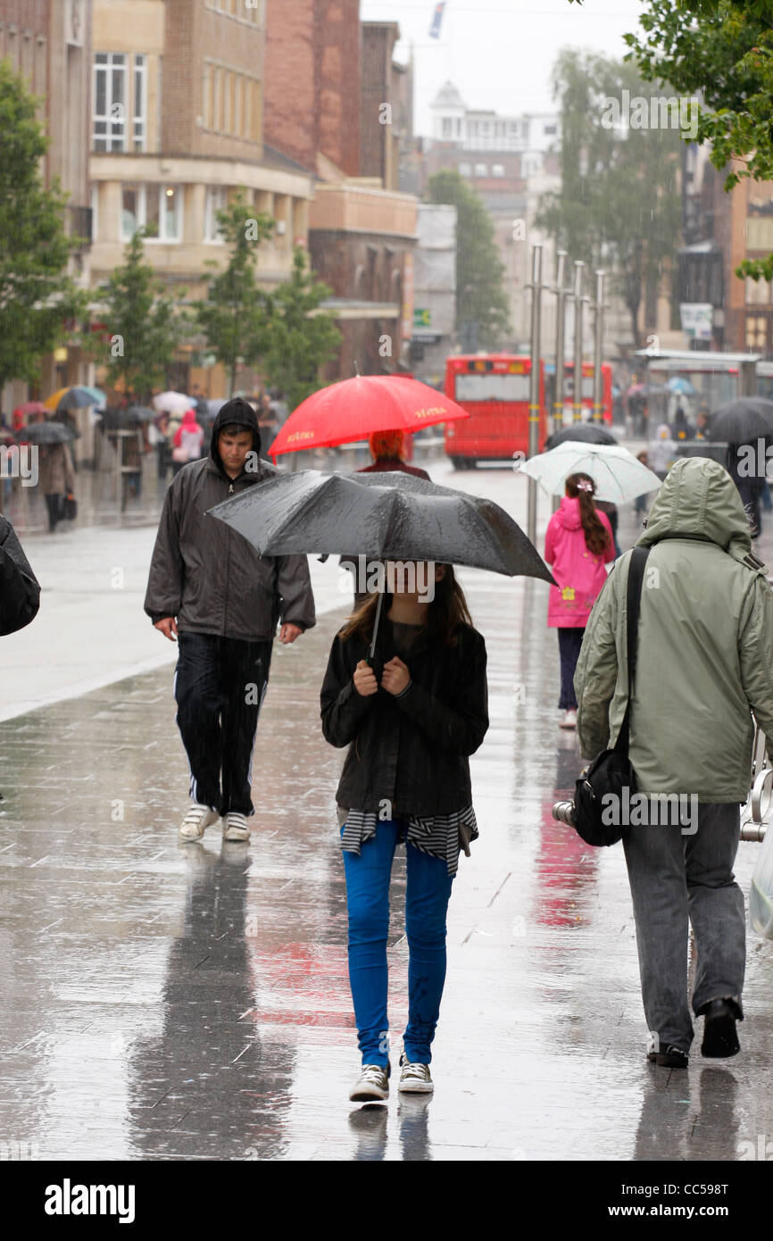 People getting wet in Exeter, Devon, UK Stock Photo - Alamy