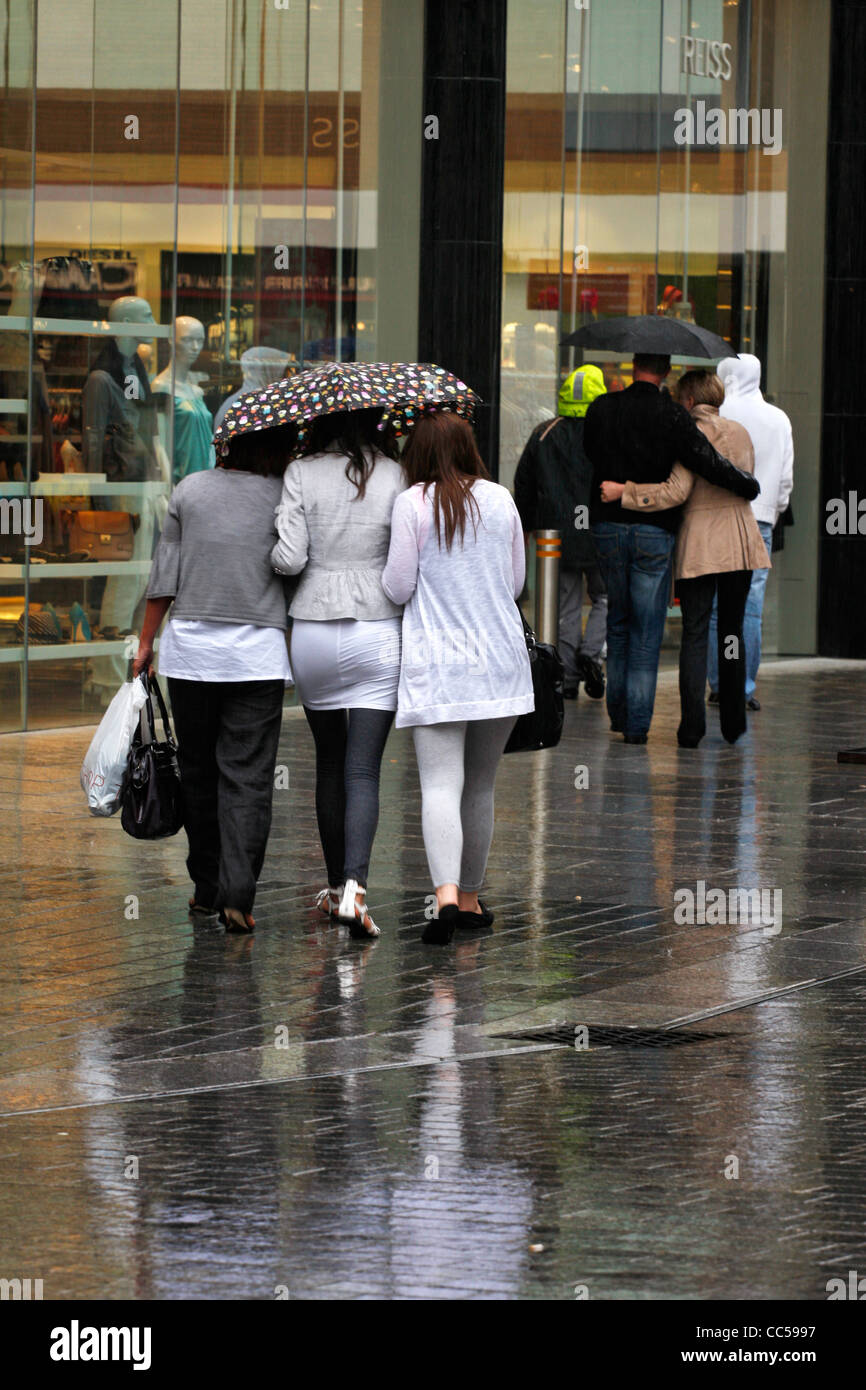 People getting wet in Exeter, Devon, UK Stock Photo - Alamy