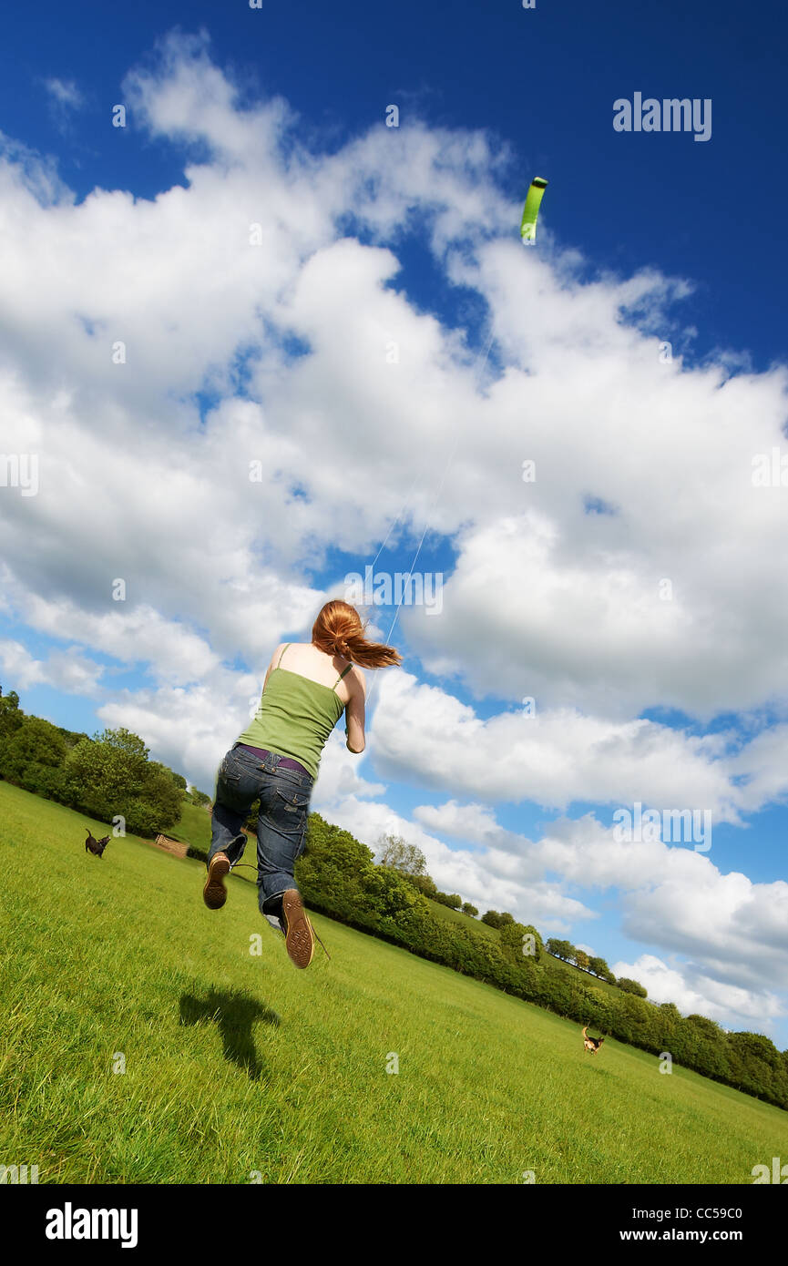 Power kite flying, girl being pulled into the air Stock Photo - Alamy