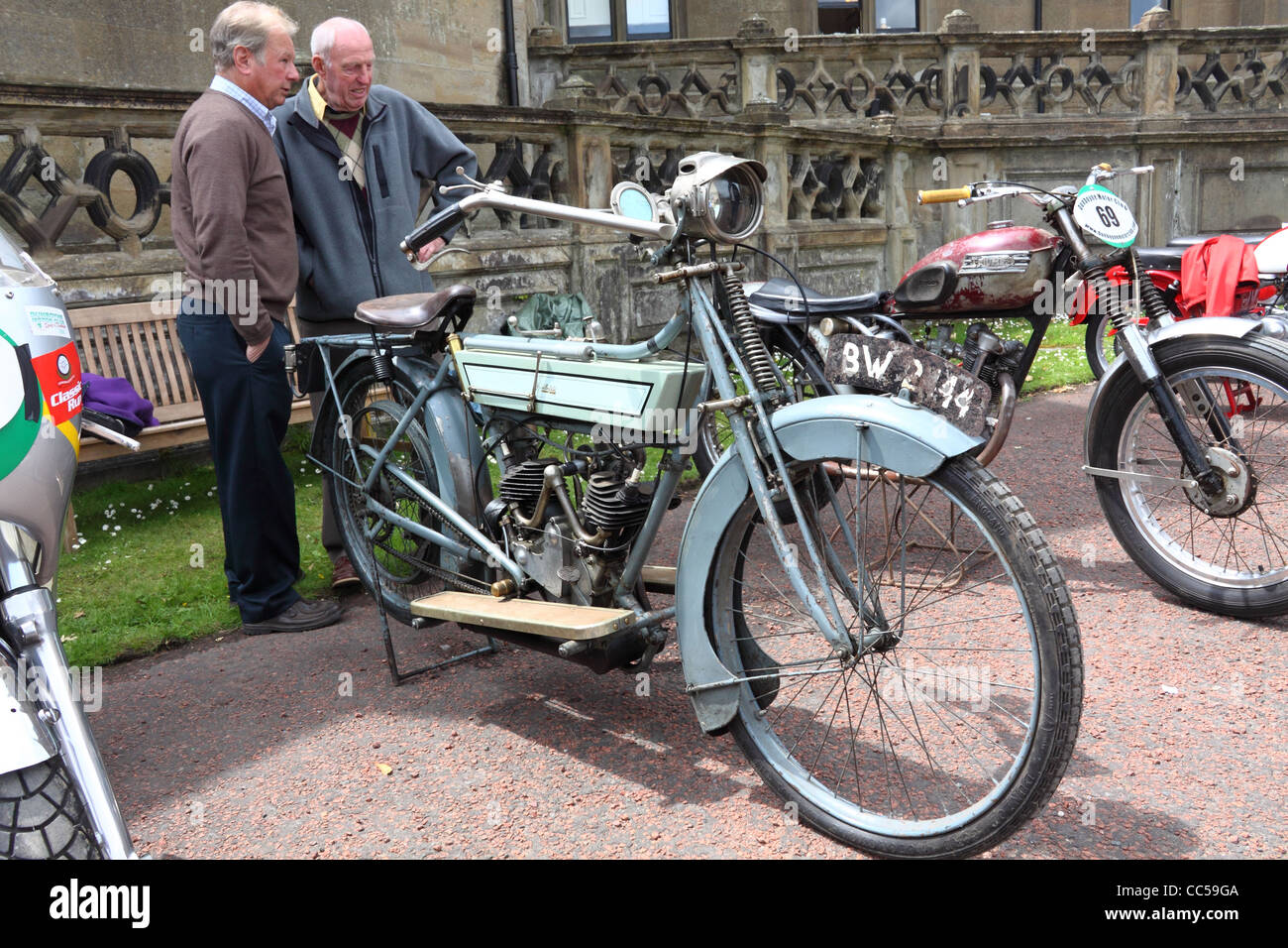 two classic motorcycle enthusiasts with a 1910's Royal Enfield at a ...