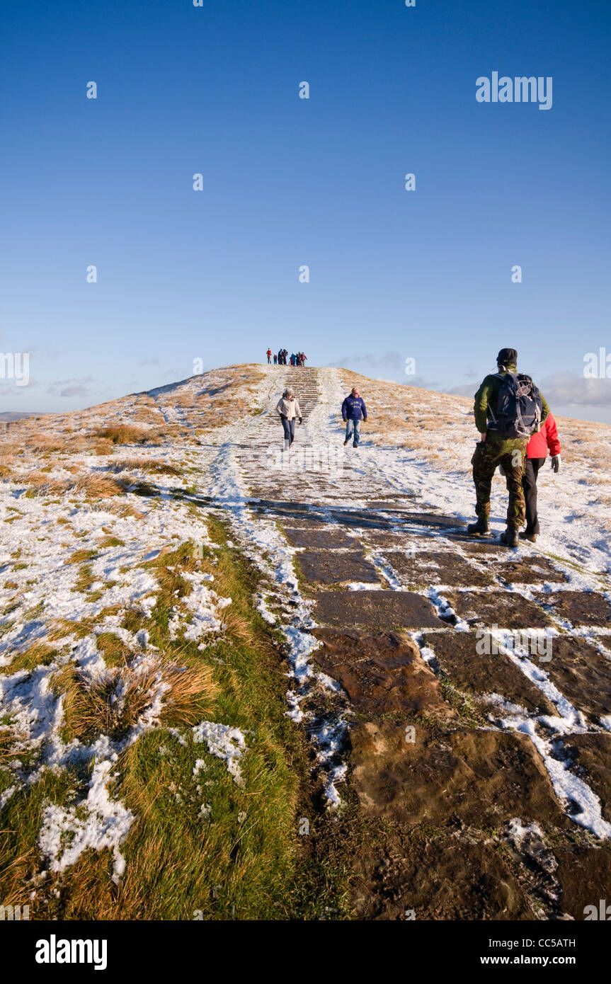 Hikers walking to the top of Mam Tor in the Peak District National Park ...