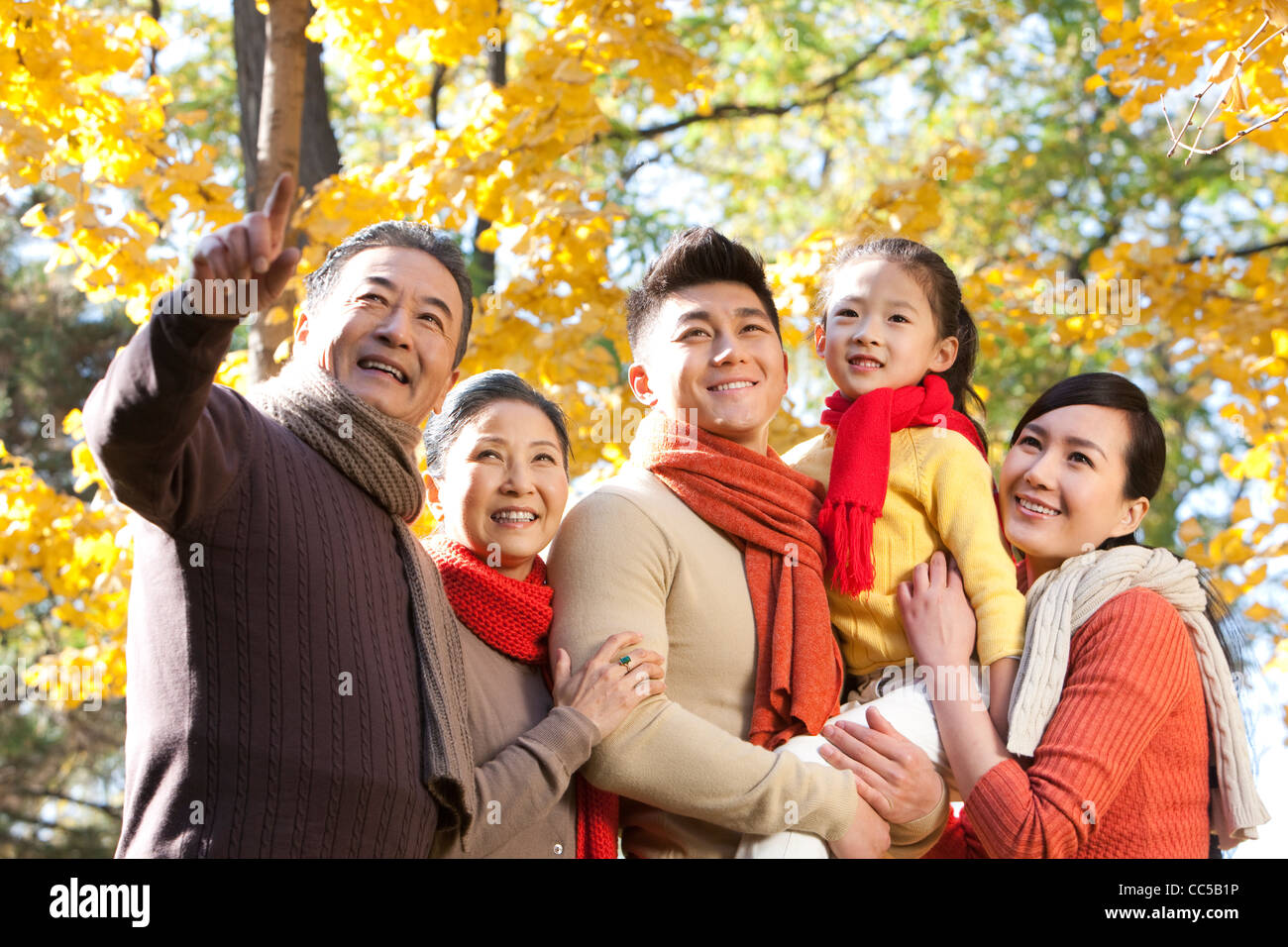 Family in a park in Autumn Stock Photo - Alamy
