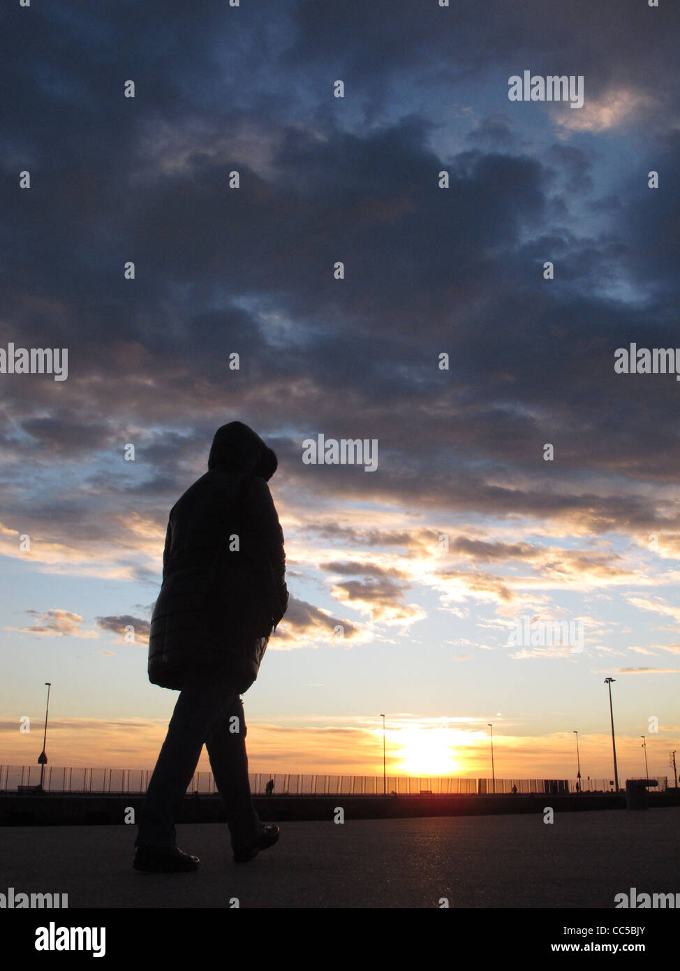 one single man silhouette by sea at sunset Stock Photo - Alamy