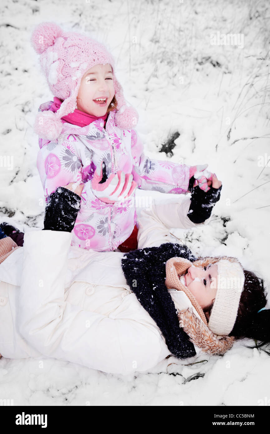 mum and daughter having fun on the snow Stock Photo - Alamy