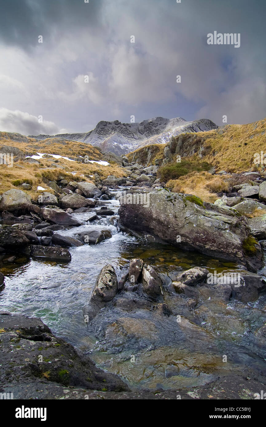 A stream in the mountains of Snowdonia, Wales, with dramatic sky Stock ...