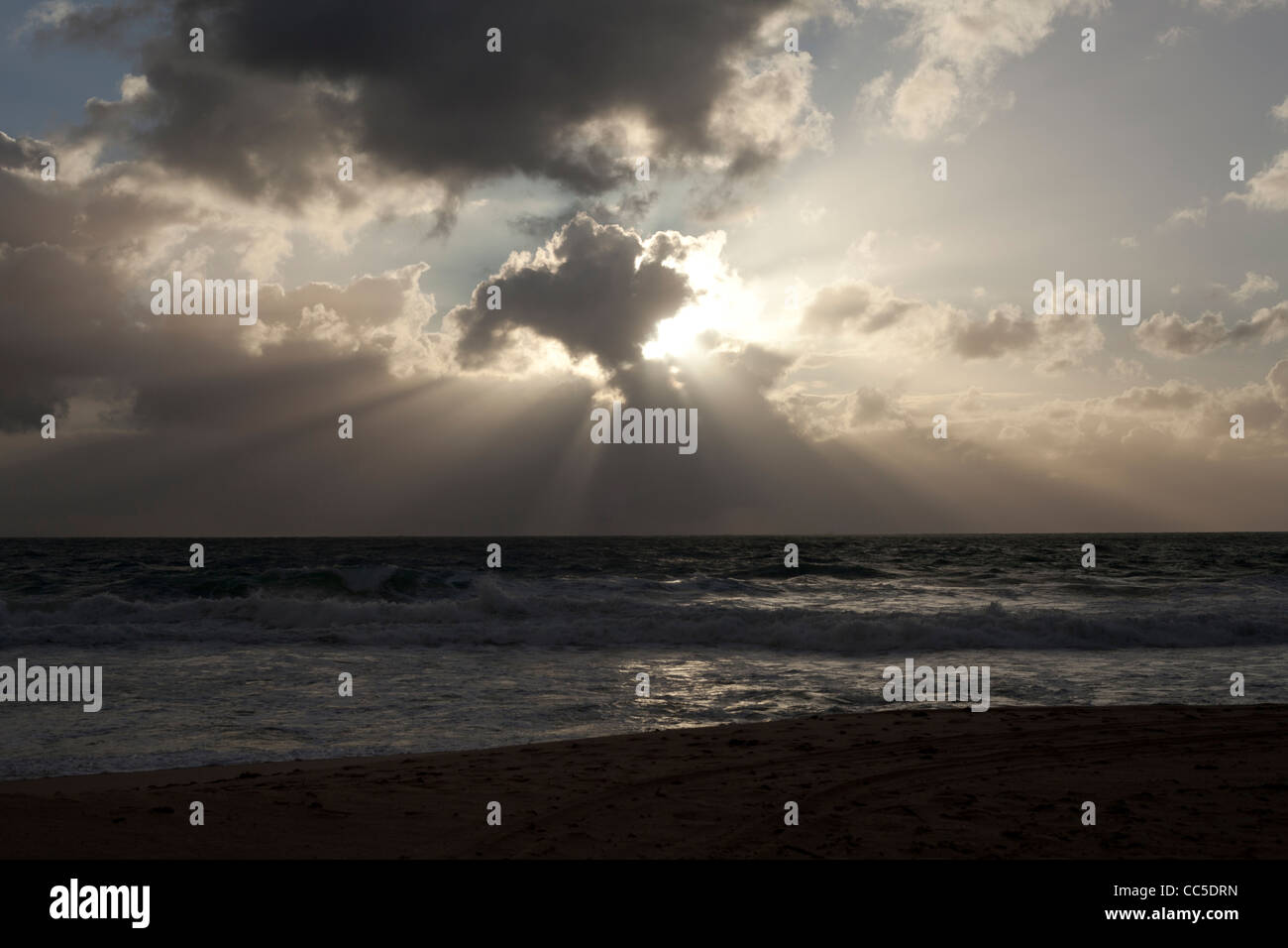 A dramatic sunset over beach Stock Photo - Alamy