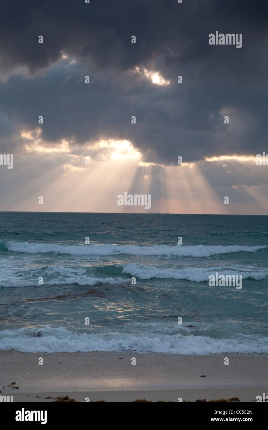 A dramatic sunset over the beach in Stock Photo - Alamy
