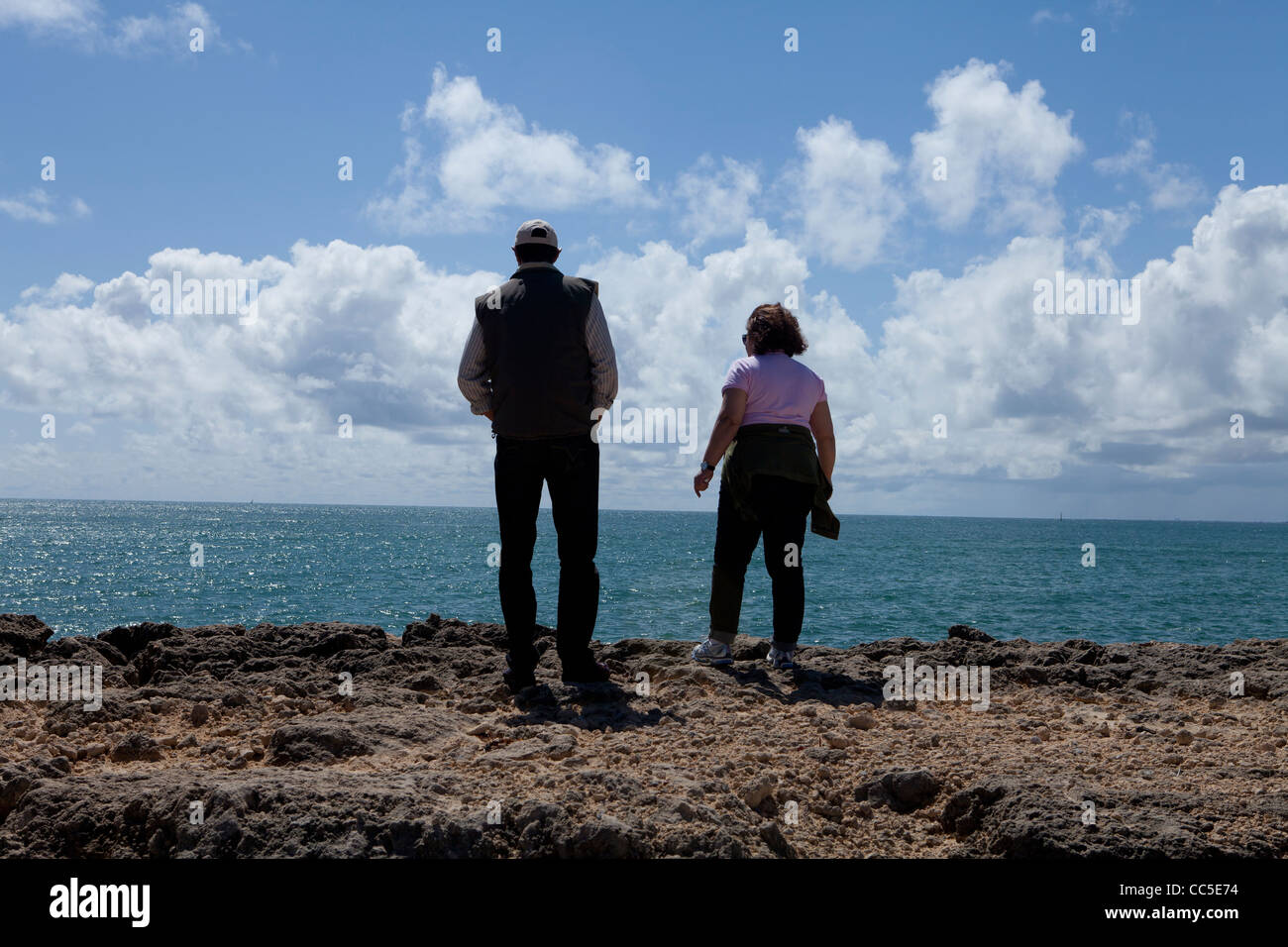 An elderly couple walk along the seafront at Mandurah, Western ...