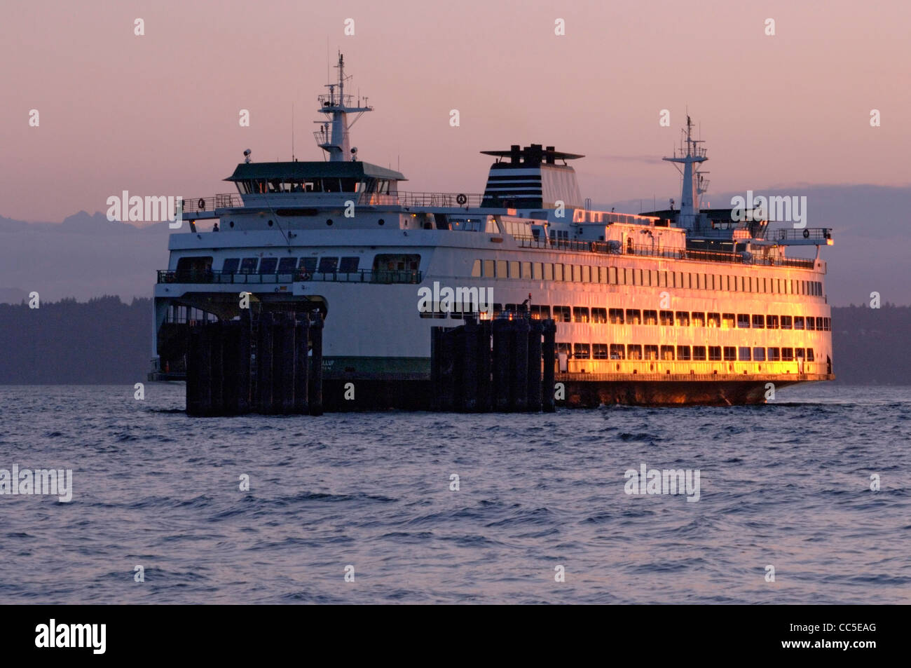 Kingston-Edmonds Ferry sails across the Puget Sound at sunset, Seattle ...