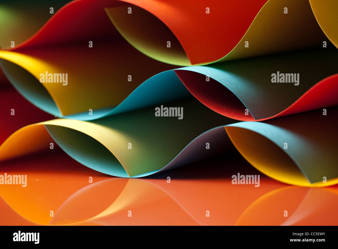 background macro image of colored origami pattern made of curved sheets ...
