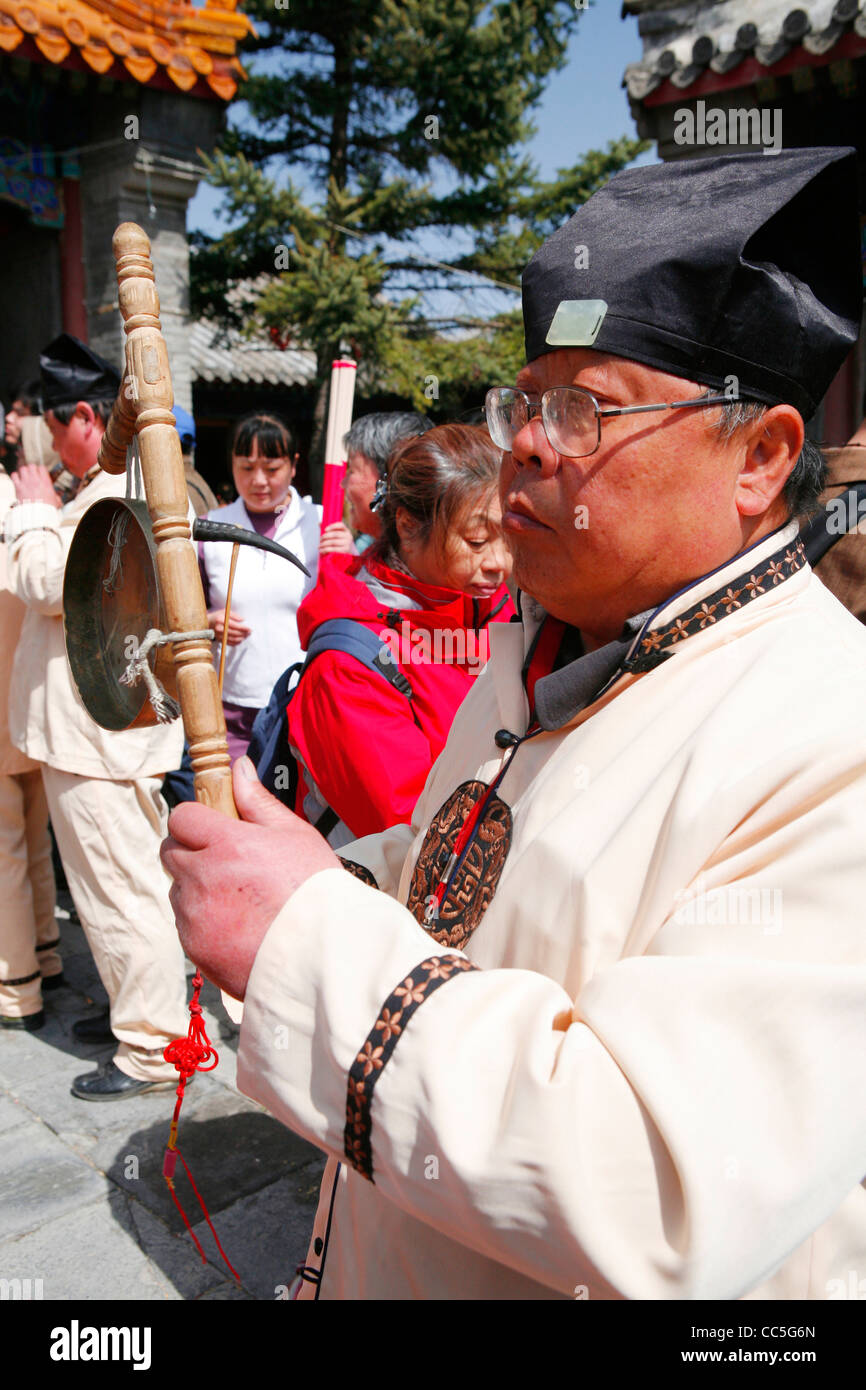 Taoist musician performing during temple fair, Miaofeng Mountain ...