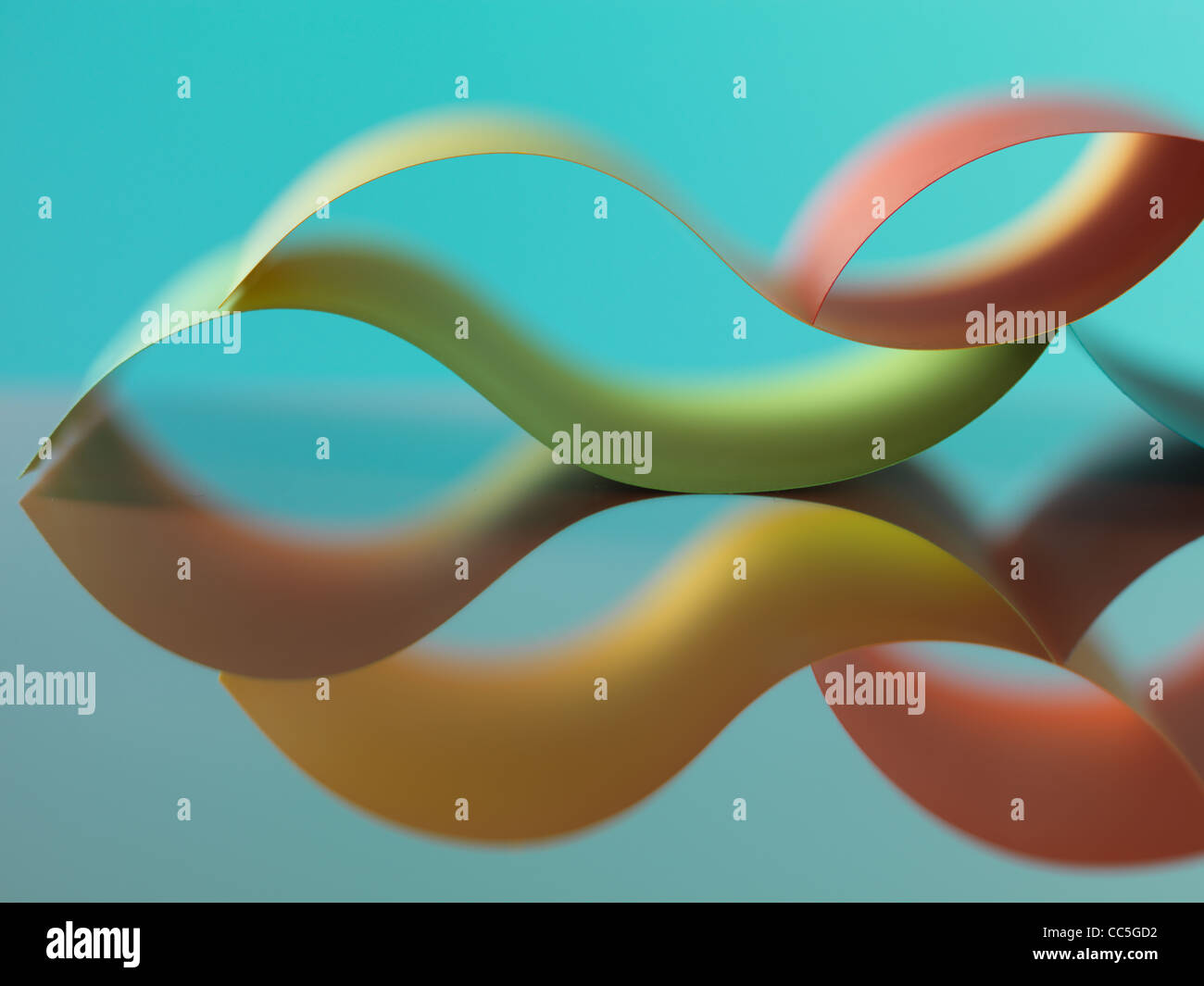 background macro image of colored origami pattern made of curved sheets ...