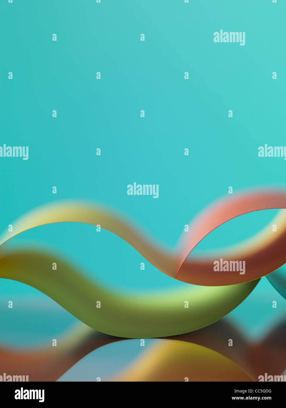 background macro image of colored origami pattern made of curved sheets ...