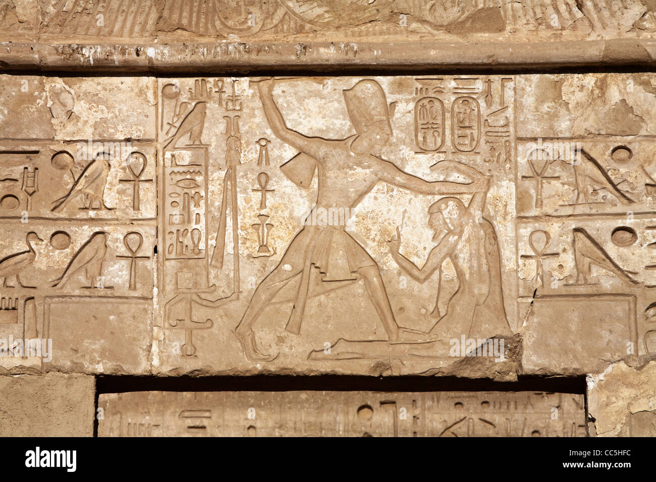 Relief of King smiting enemy in the Mortuary Temple of Pharaoh Ramesses ...