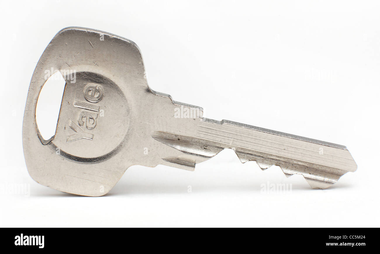 Yale door key on white background. Picture by Jamie Mann Stock Photo ...