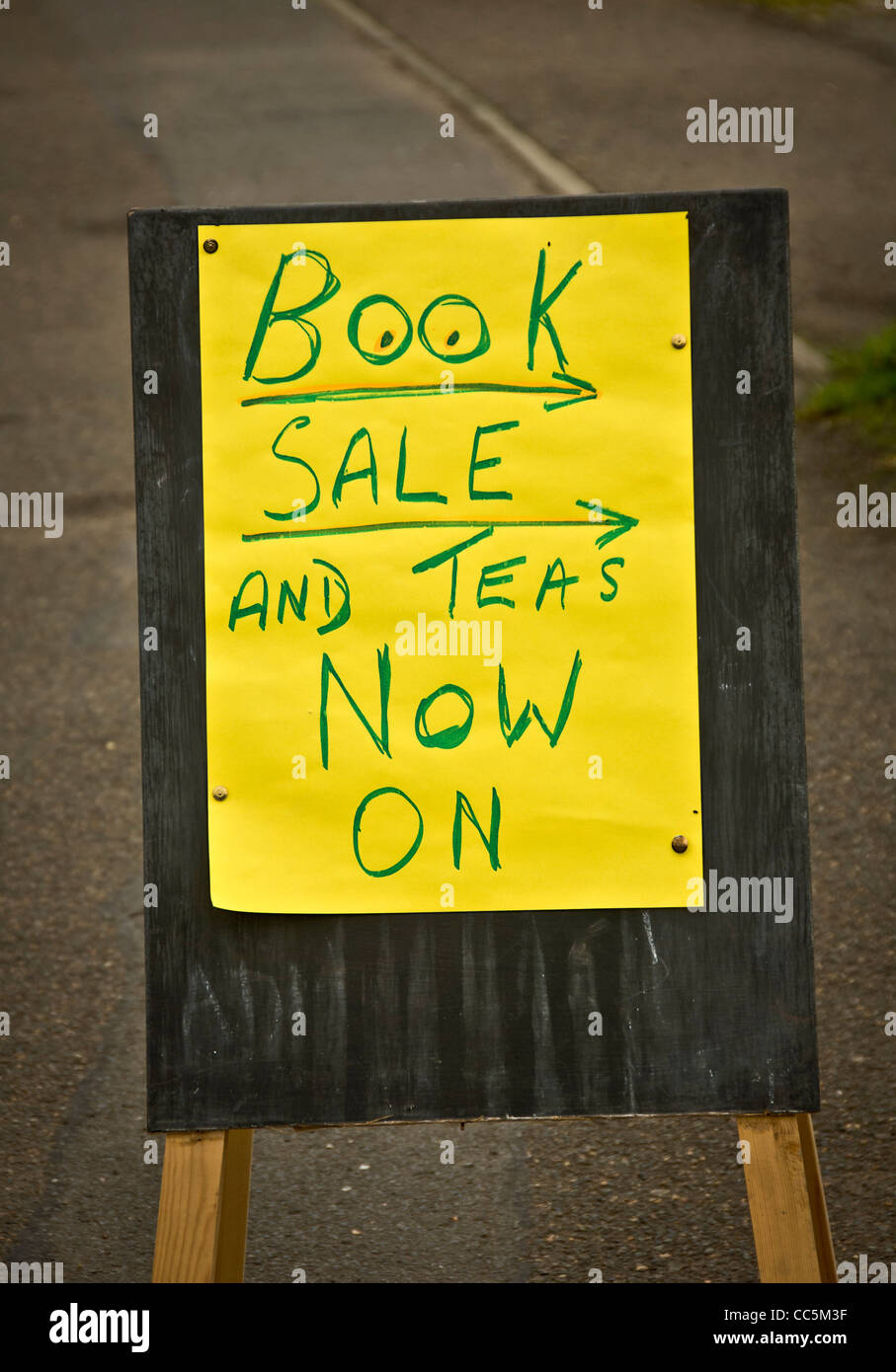 Handwritten sign on 'A-Board' for a book Sale and teas Stock Photo - Alamy