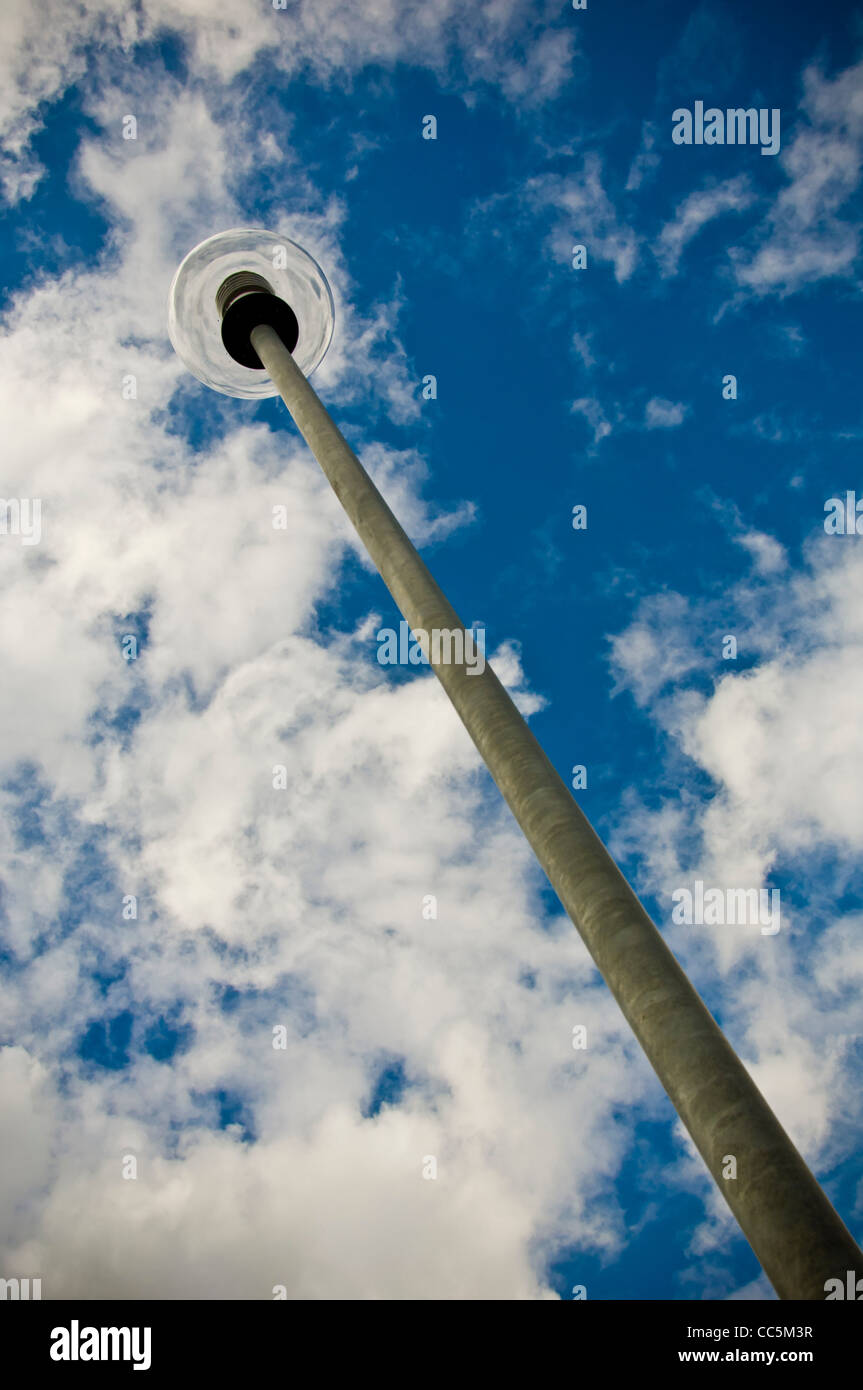 Modern metal street light shot from a low angle looking up towards a ...