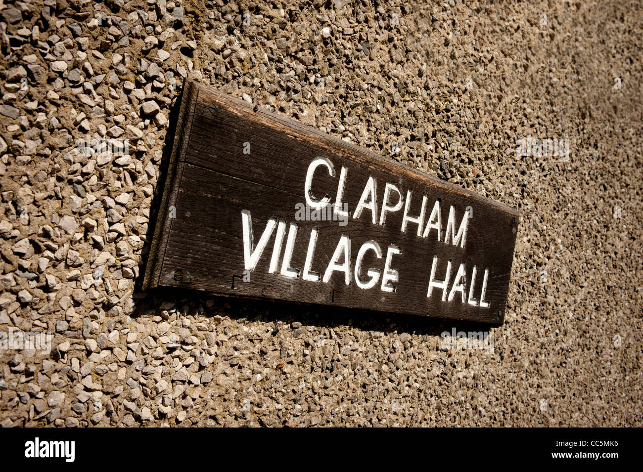 Clapham village hall sign on a wall Stock Photo - Alamy