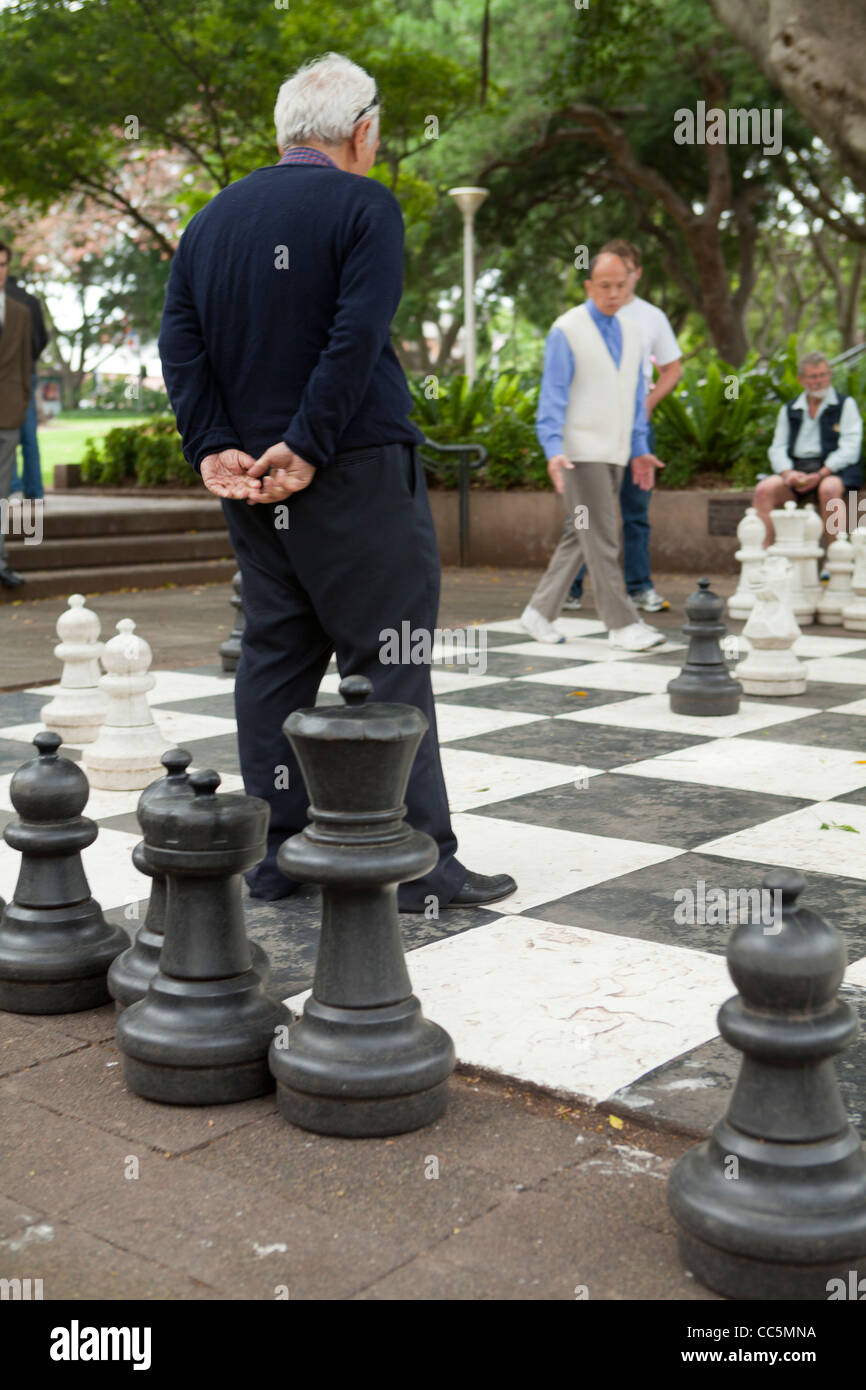 Two men have a game of street chess in Hyde Park, Sydney, Australia ...