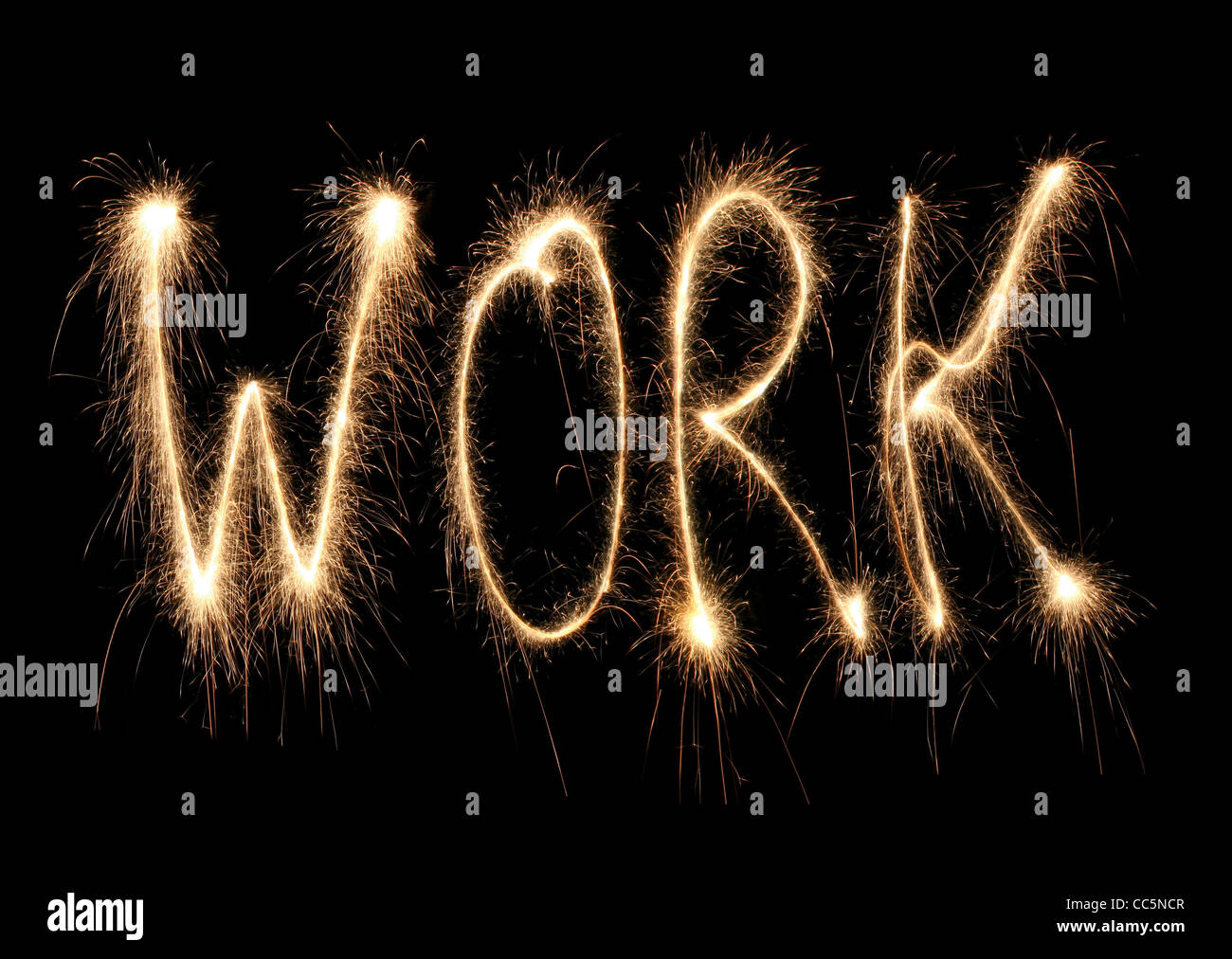 Word work written sparkler Stock Photo - Alamy